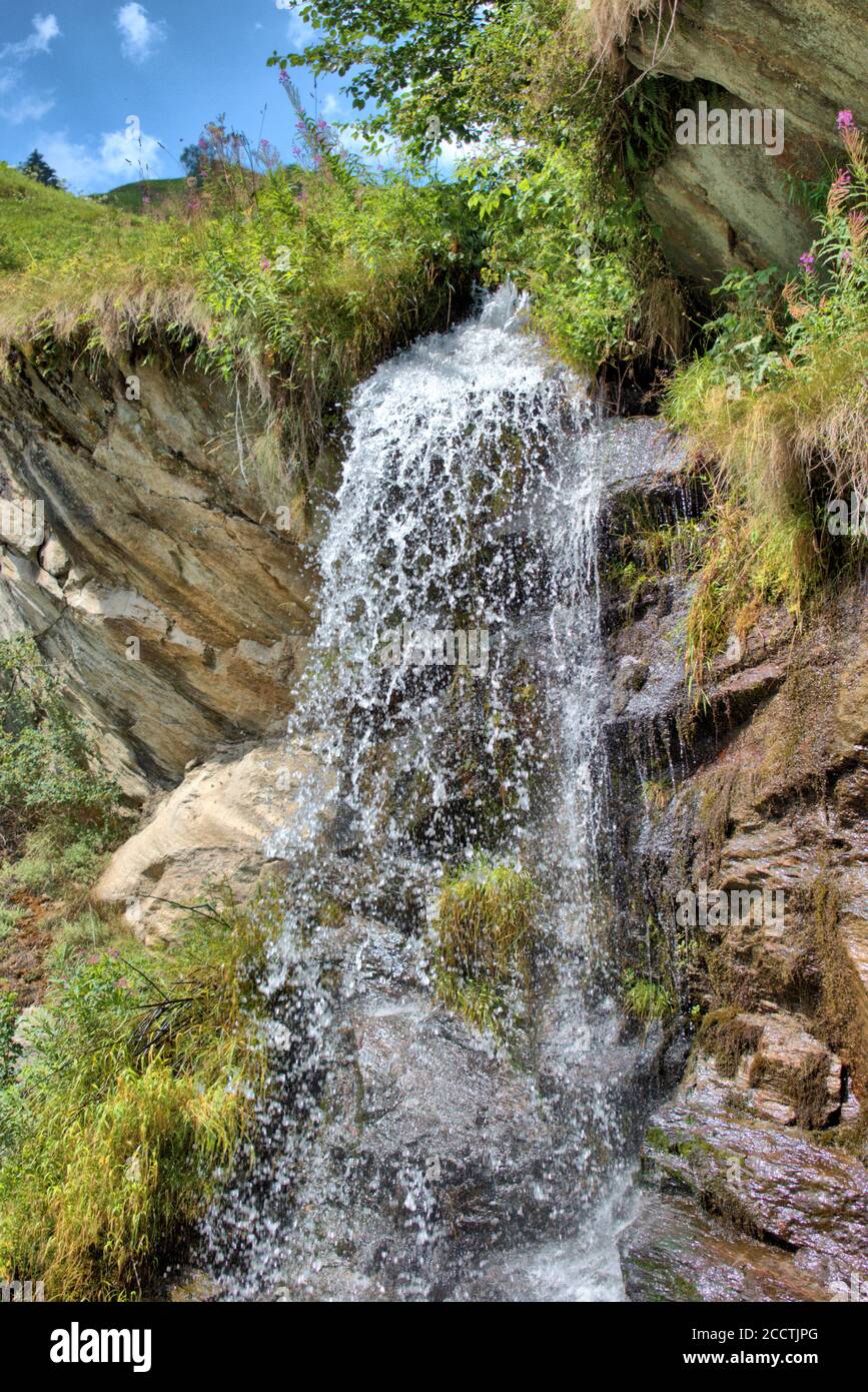 Alpine little waterfall in Vals in Switzerland Stock Photo - Alamy