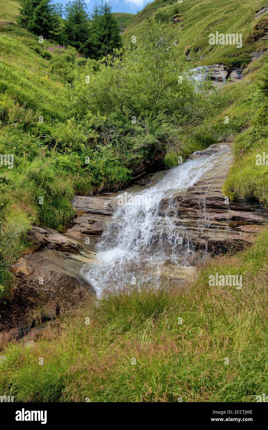 Alpine little waterfall in Vals in Switzerland Stock Photo - Alamy