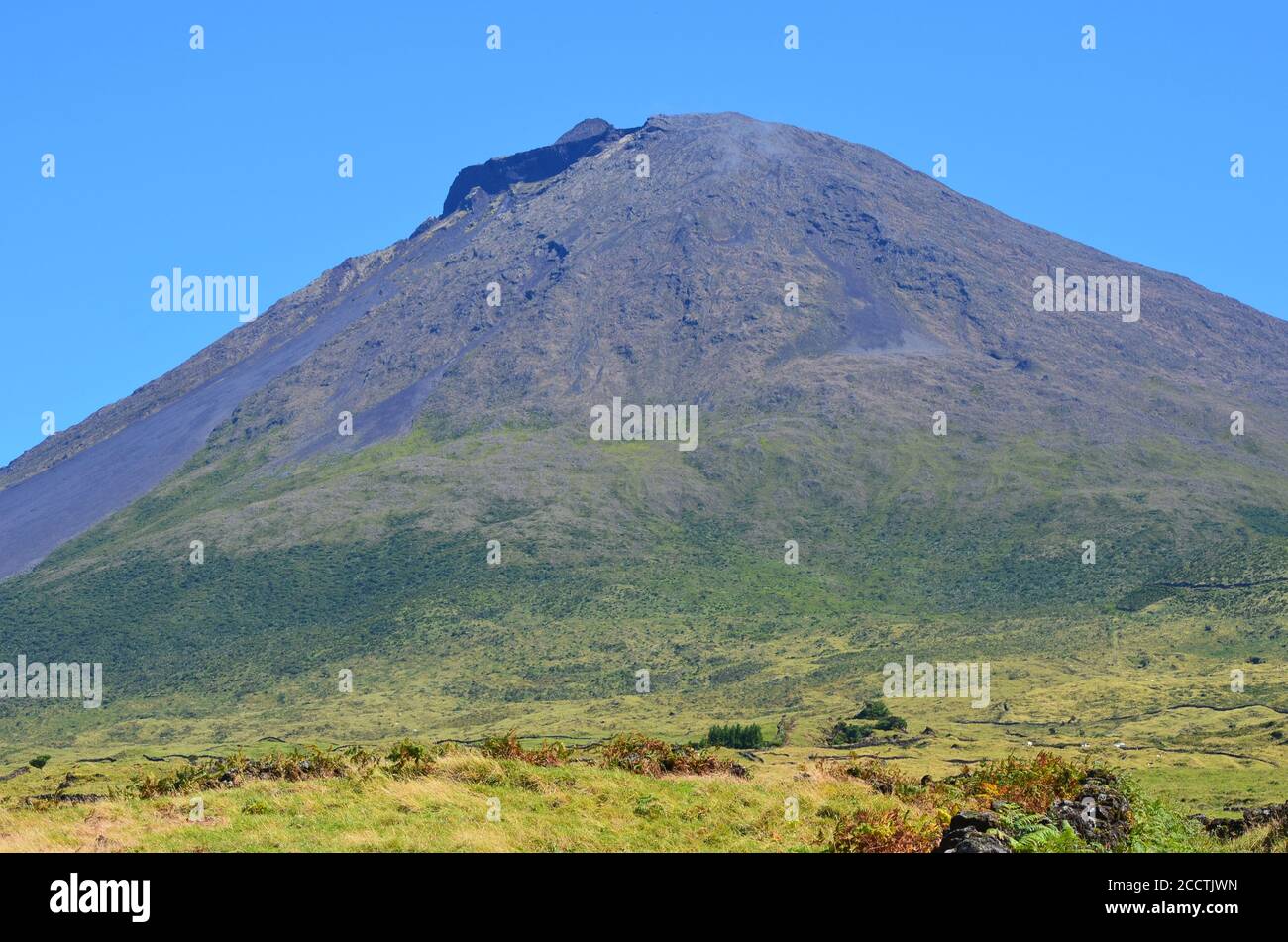 The conical Pico volcano looming over its namesake island (Azores ...