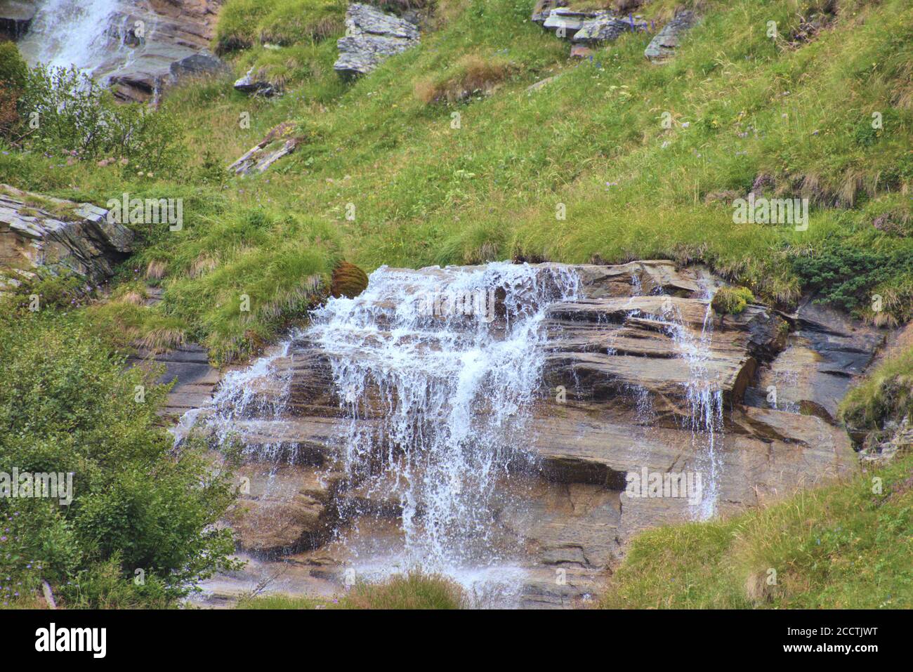 Alpine little waterfall in Vals in Switzerland Stock Photo - Alamy