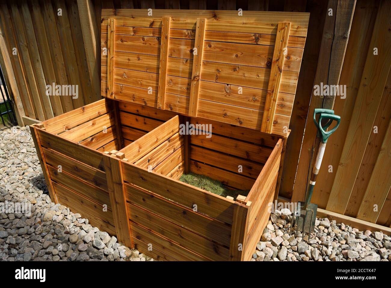 Two bin composter made of cedar wood with open lid for grass clippings ...