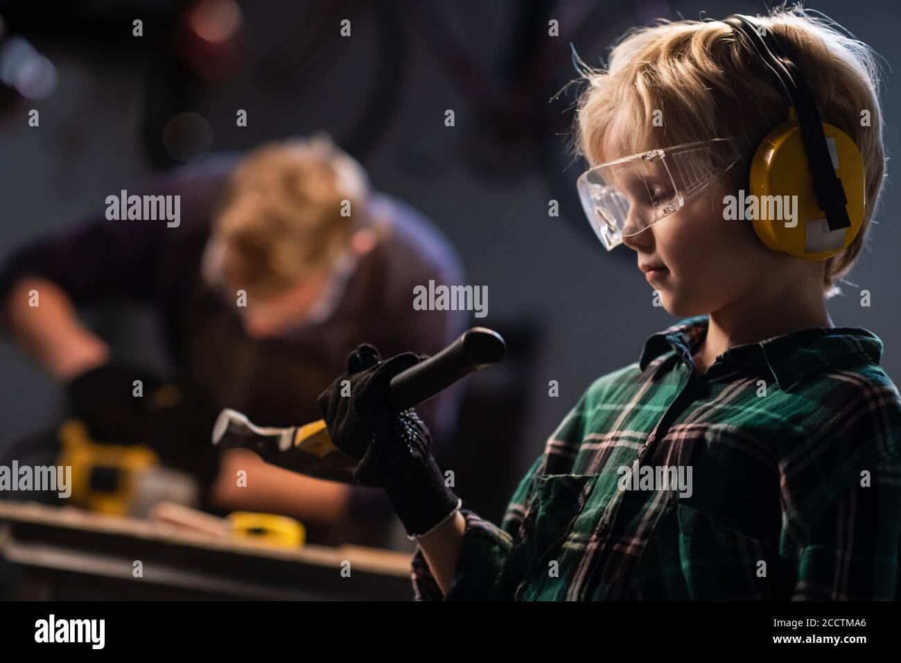 a little boy at school with a labor teacher in a carpentry shop Stock ...