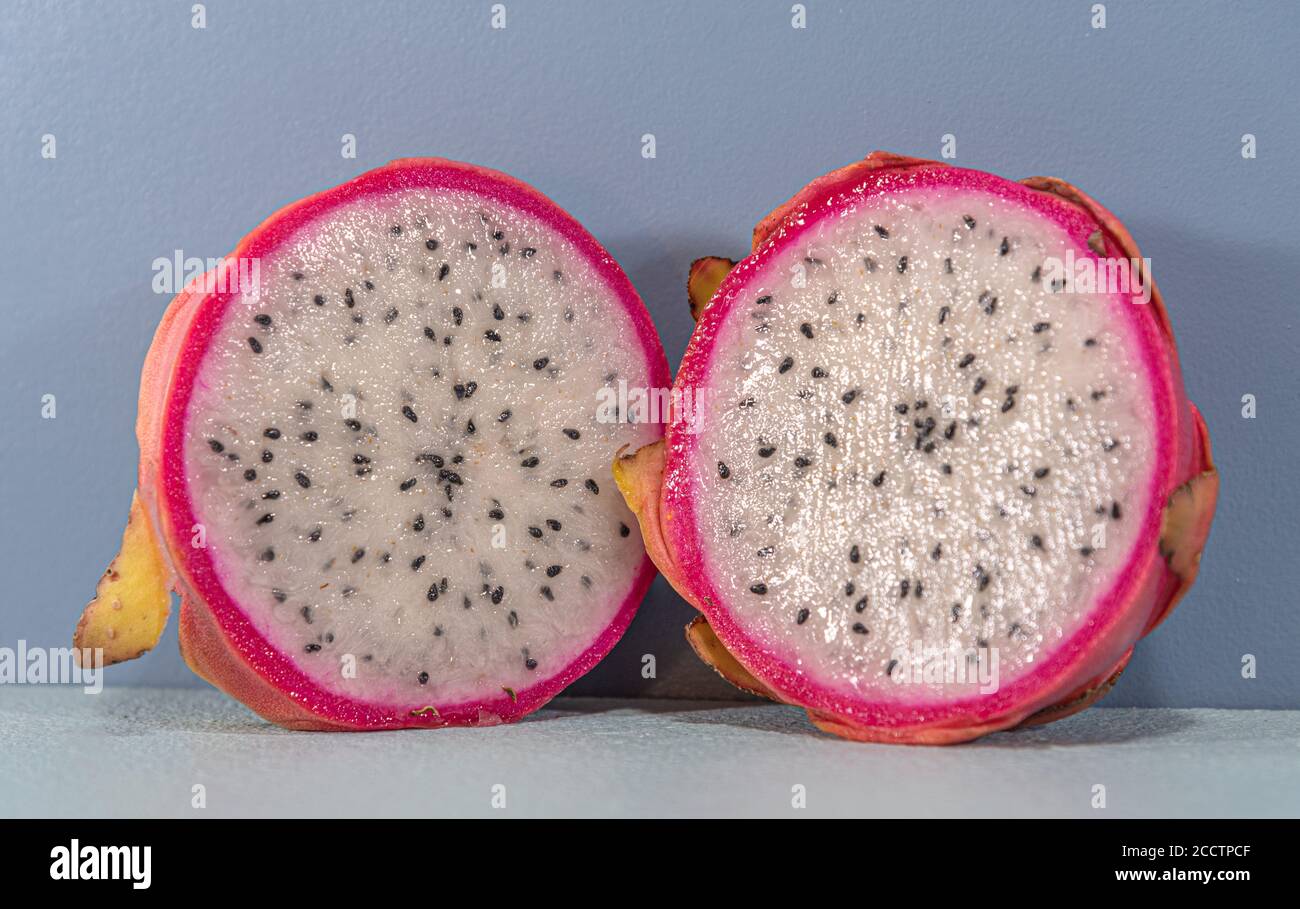 Pitaya fruit (Selenicereus setaceus). Exotic fruit. Fruit halved ...