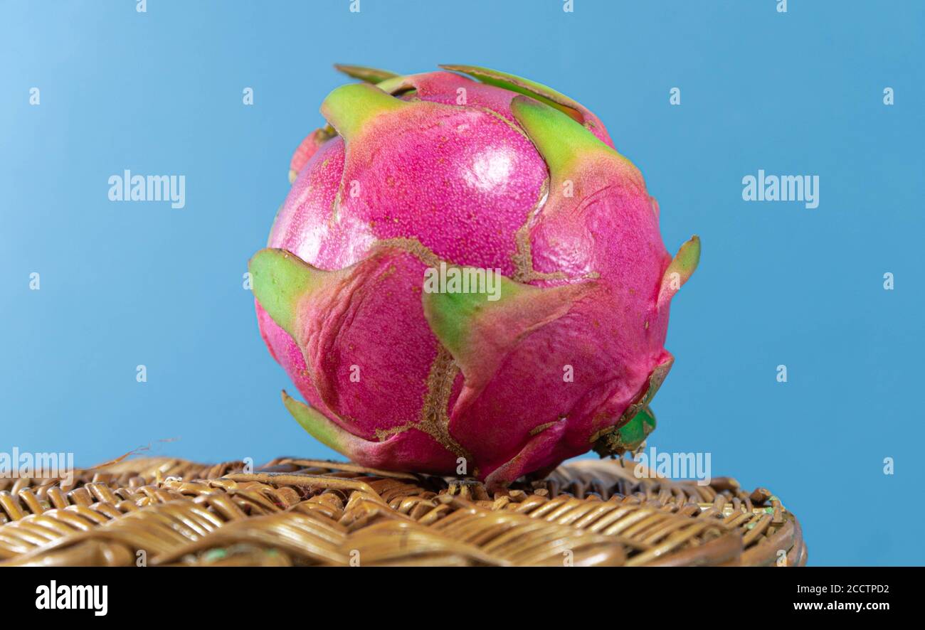 Pitaya fruits. Dragon fruit. Blue background. Pitaya is a natural fruit ...