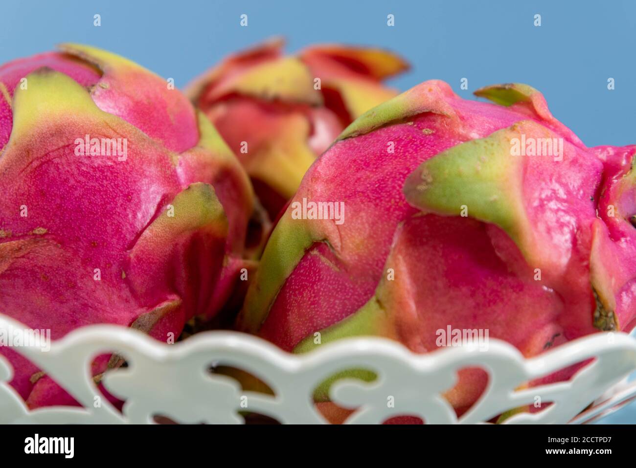 Pitaya fruits. Dragon fruit. Blue background. Pitaya is a natural fruit ...