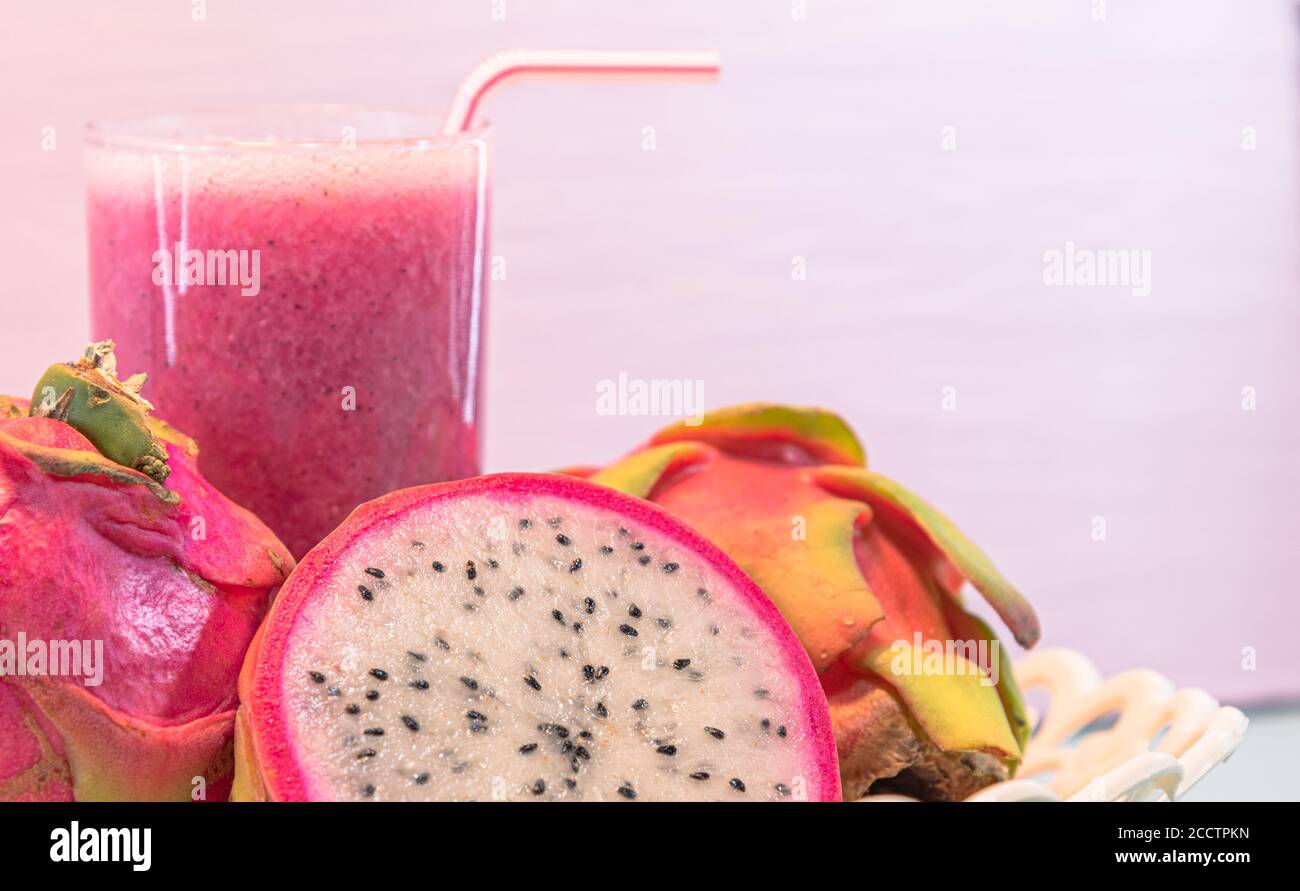 Pitaya juice and fruits. Pitaya (scientific name Cereus undatus) is a ...
