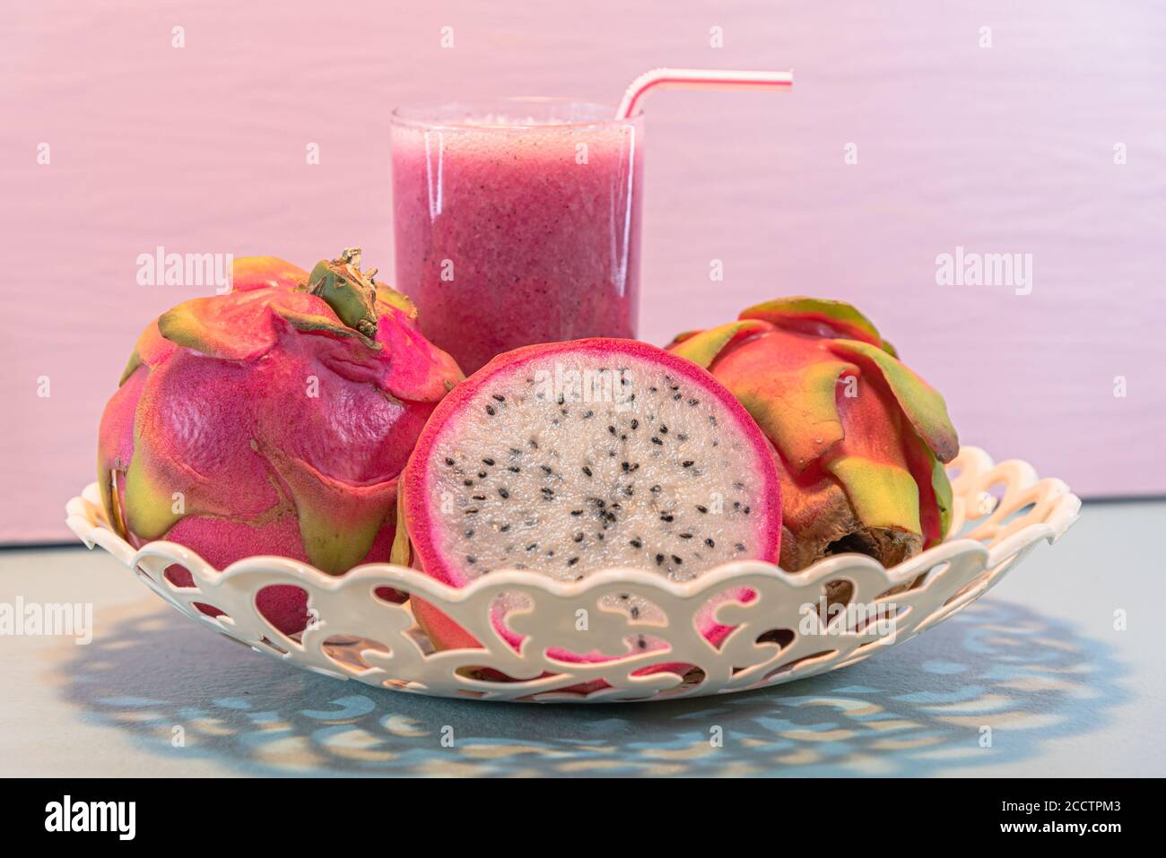 Pitaya juice and fruits. Pitaya (scientific name Cereus undatus) is a ...