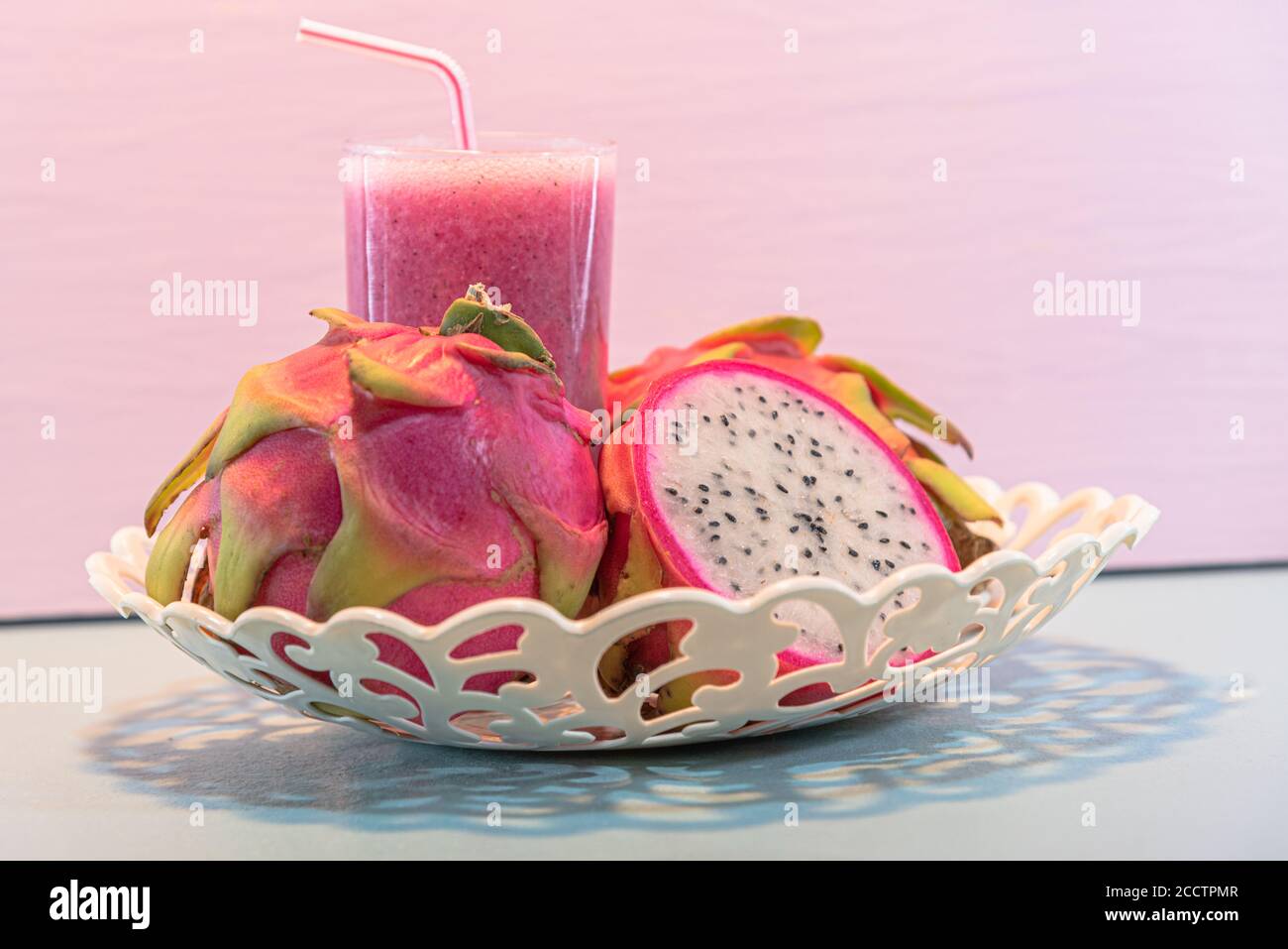 Pitaya juice and fruits. Pitaya (scientific name Cereus undatus) is a ...