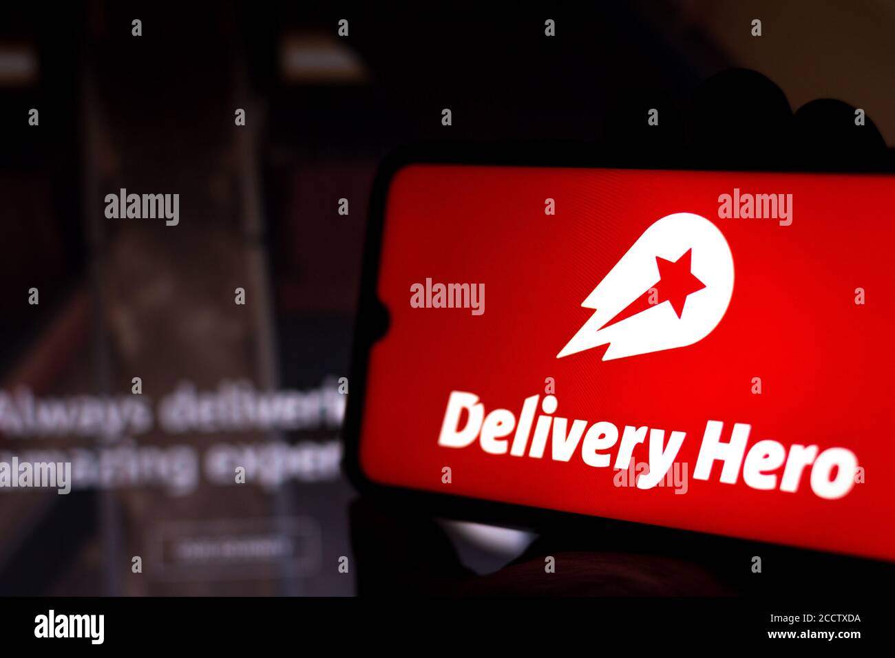 In this photo illustration the Delivery Hero logo seen displayed on a ...