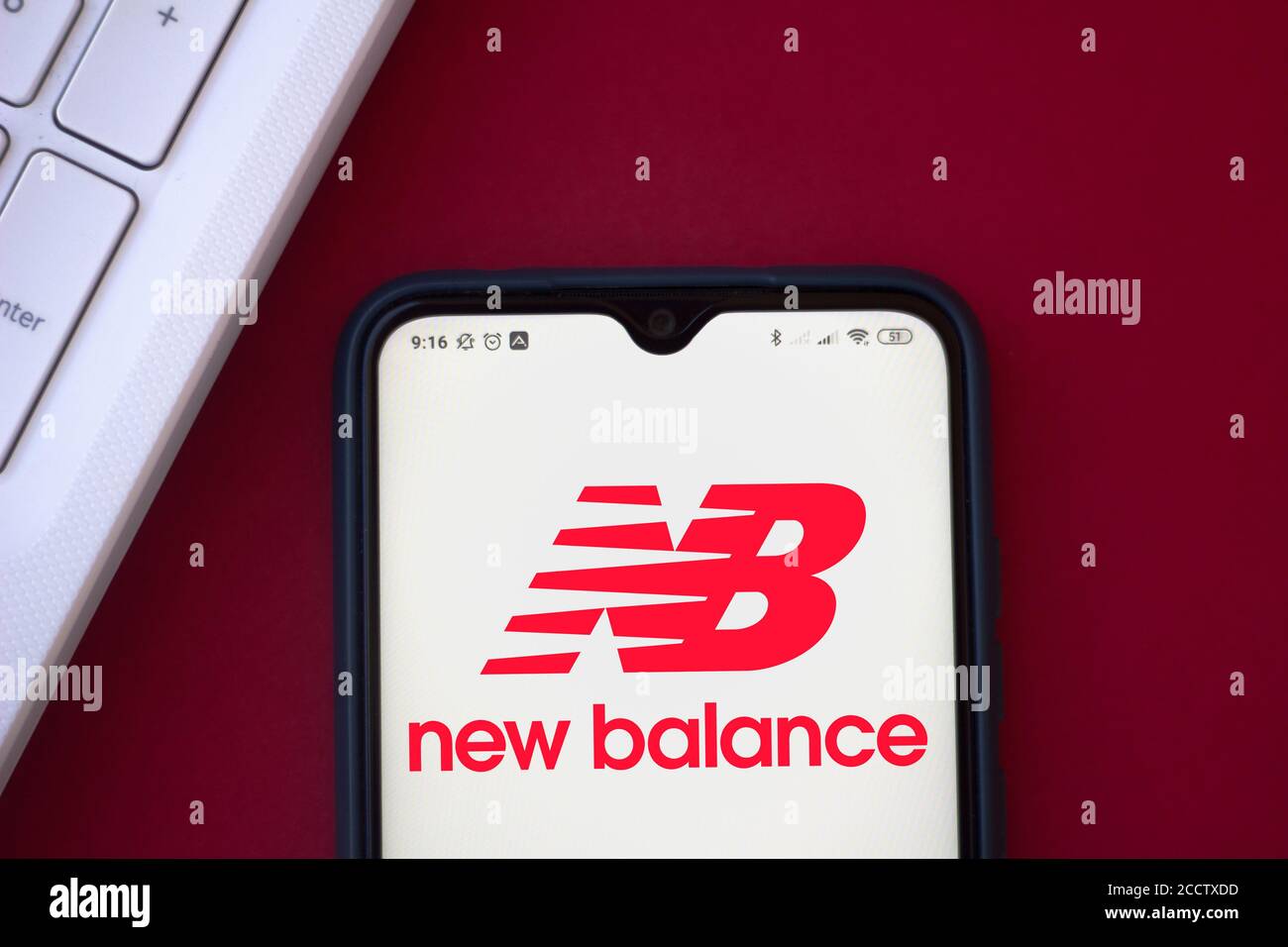 In this photo illustration the New Balance Athletic Shoe logo seen ...