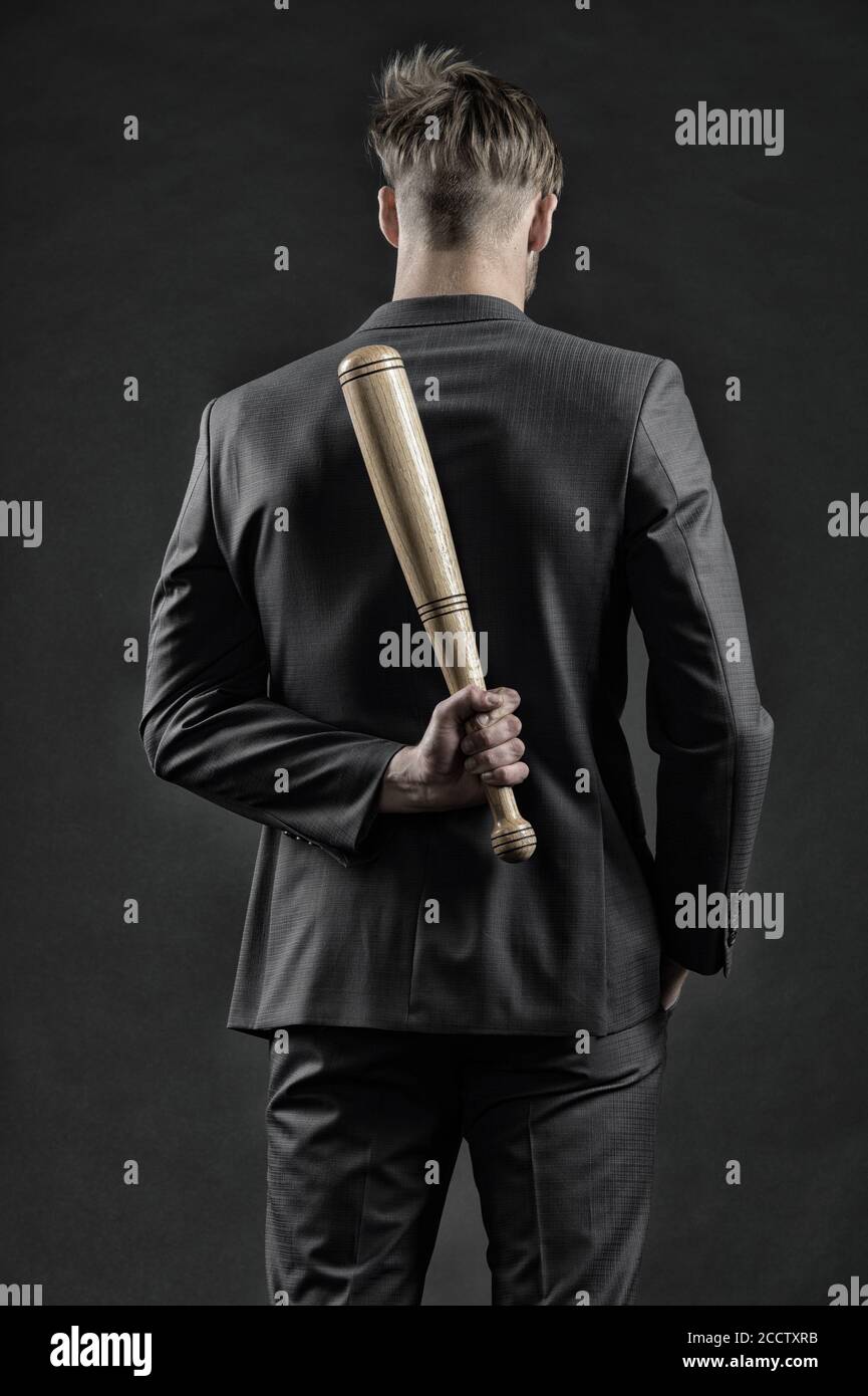 Latent aggression. Man with bat hides his aggression slow down and keep ...