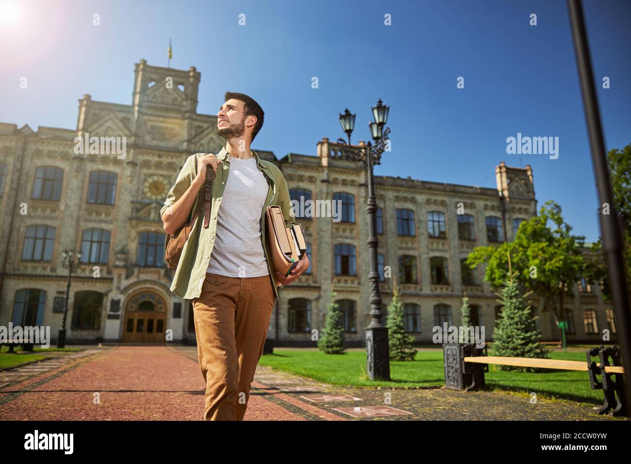 Male student looking up at the sky Stock Photo - Alamy