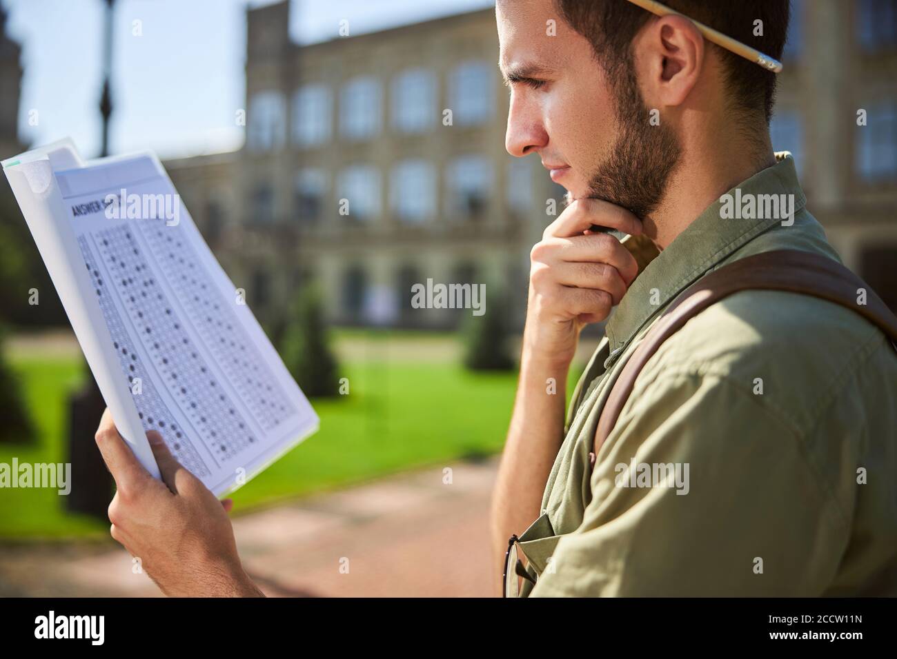 Serious student studying for a multiple choice exam Stock Photo - Alamy