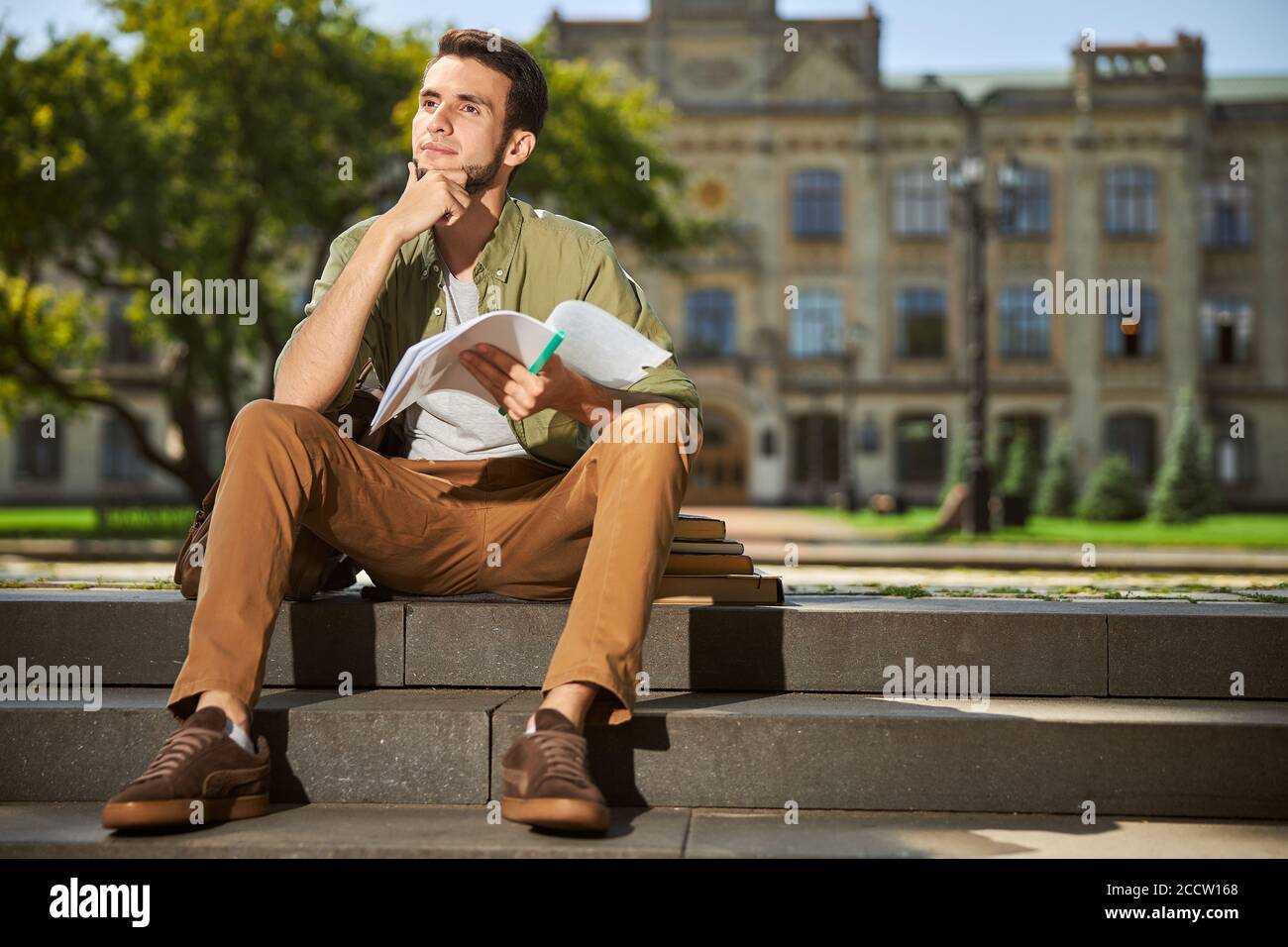 Male student pondering over a home assignment Stock Photo - Alamy