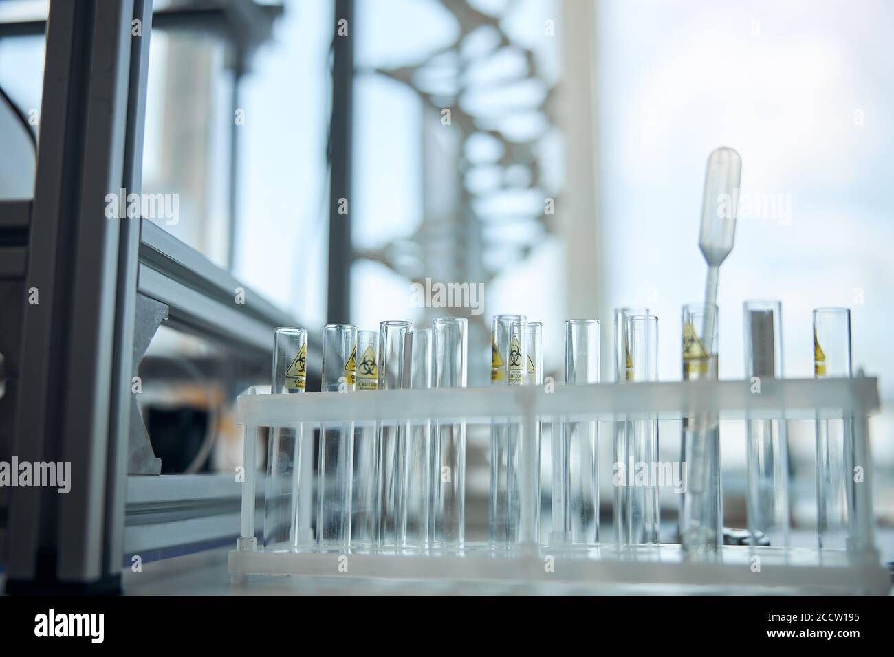 Numerous test tubes labeled with a biohazard sign Stock Photo - Alamy