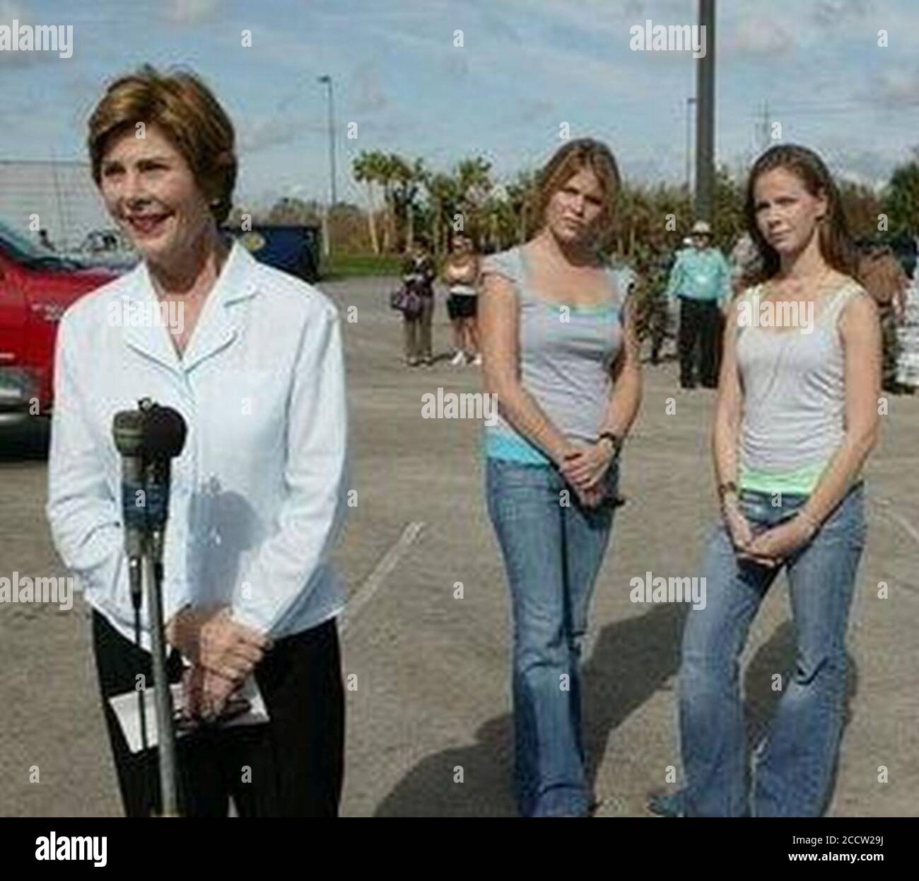 Jenna and Barbara Bush behind Laura Bush Stock Photo - Alamy