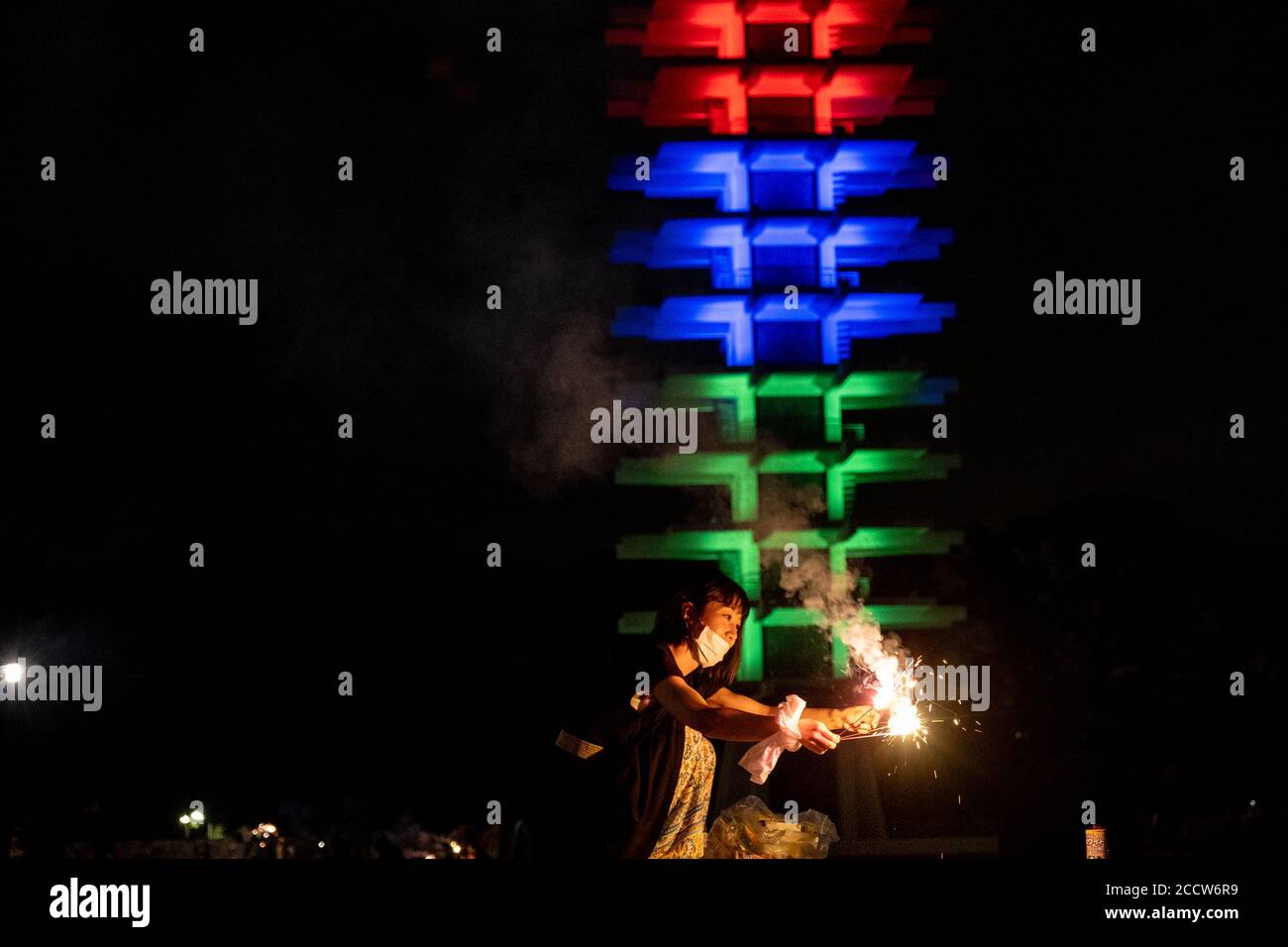 Tokyo, Japan. 24th Aug, 2020. A couple is seen playing firecrackers in ...