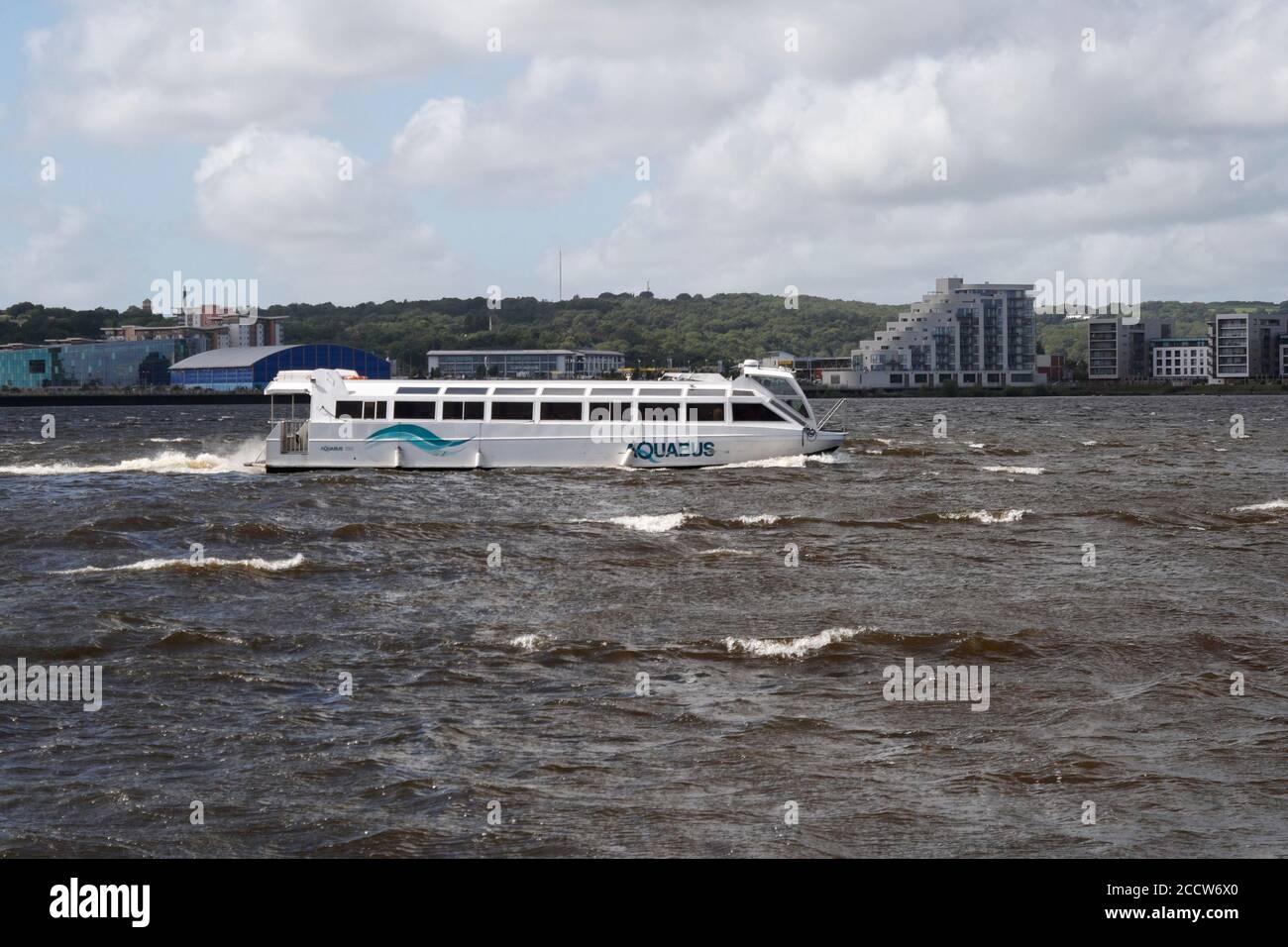 Aquabus travelling on a choppy Cardiff bay, Wales UK body of water ...