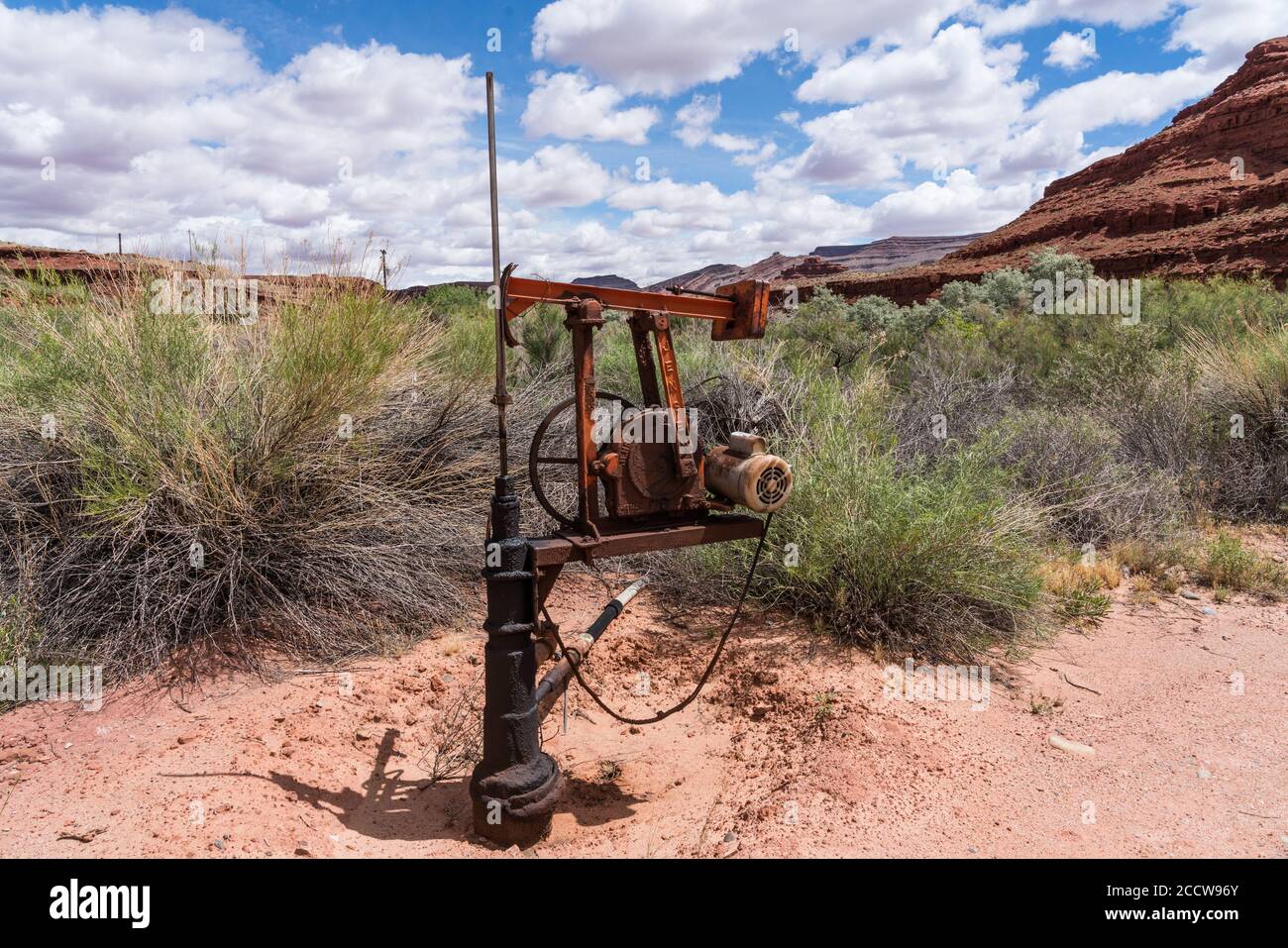 A shallow oil well with a very small pump jack in southeastern Utah ...