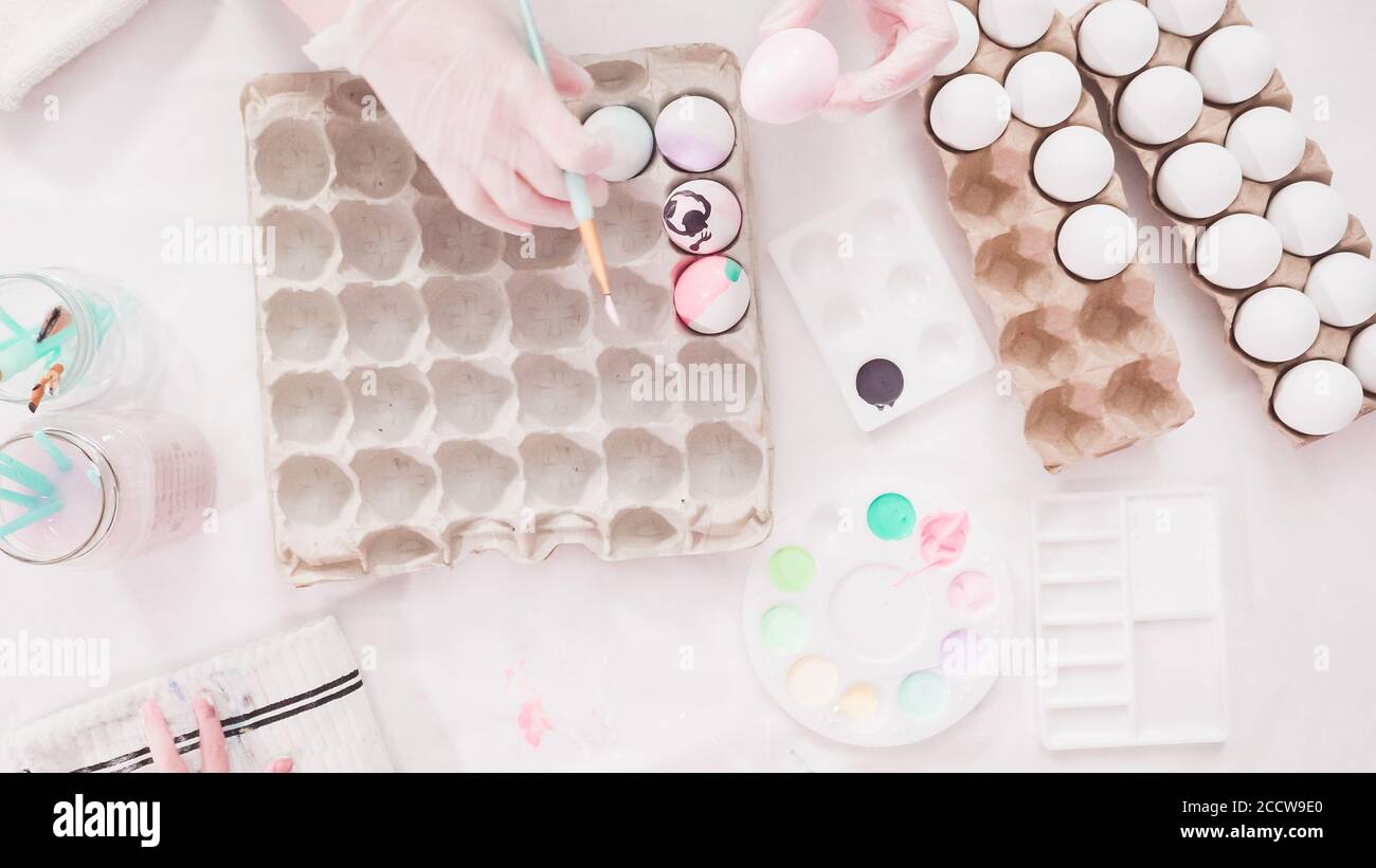 Flat lay. Painting craft Easter eggs with acrilic paint Stock Photo - Alamy