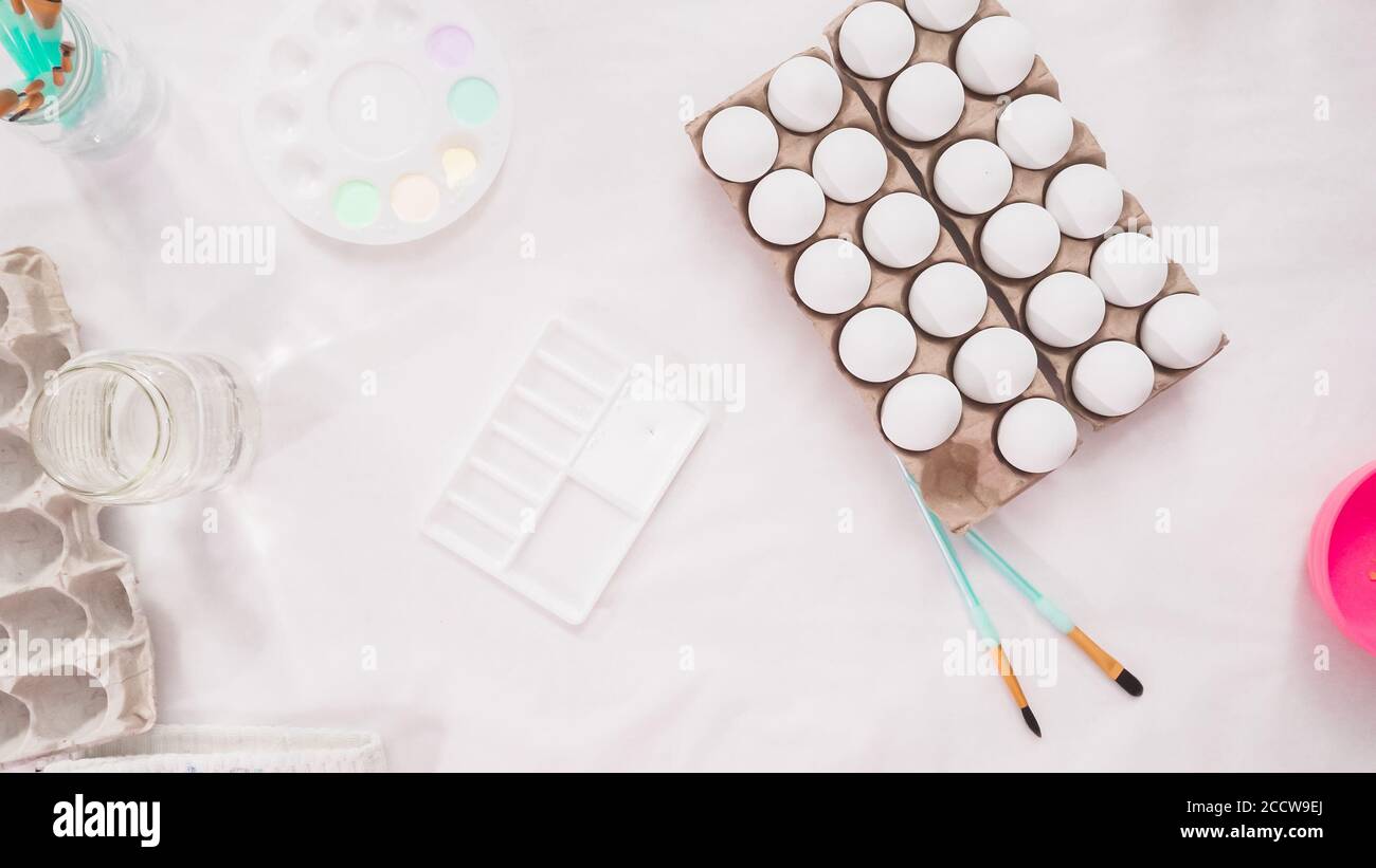 Flat lay. Painting craft Easter eggs with acrilic paint Stock Photo - Alamy