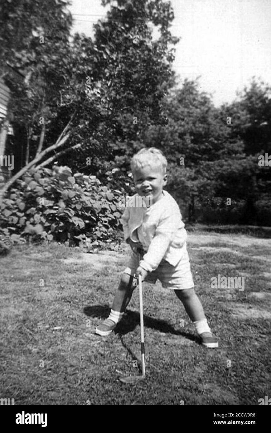 Jeb Bush with a golf club. Summer 1955 Stock Photo - Alamy