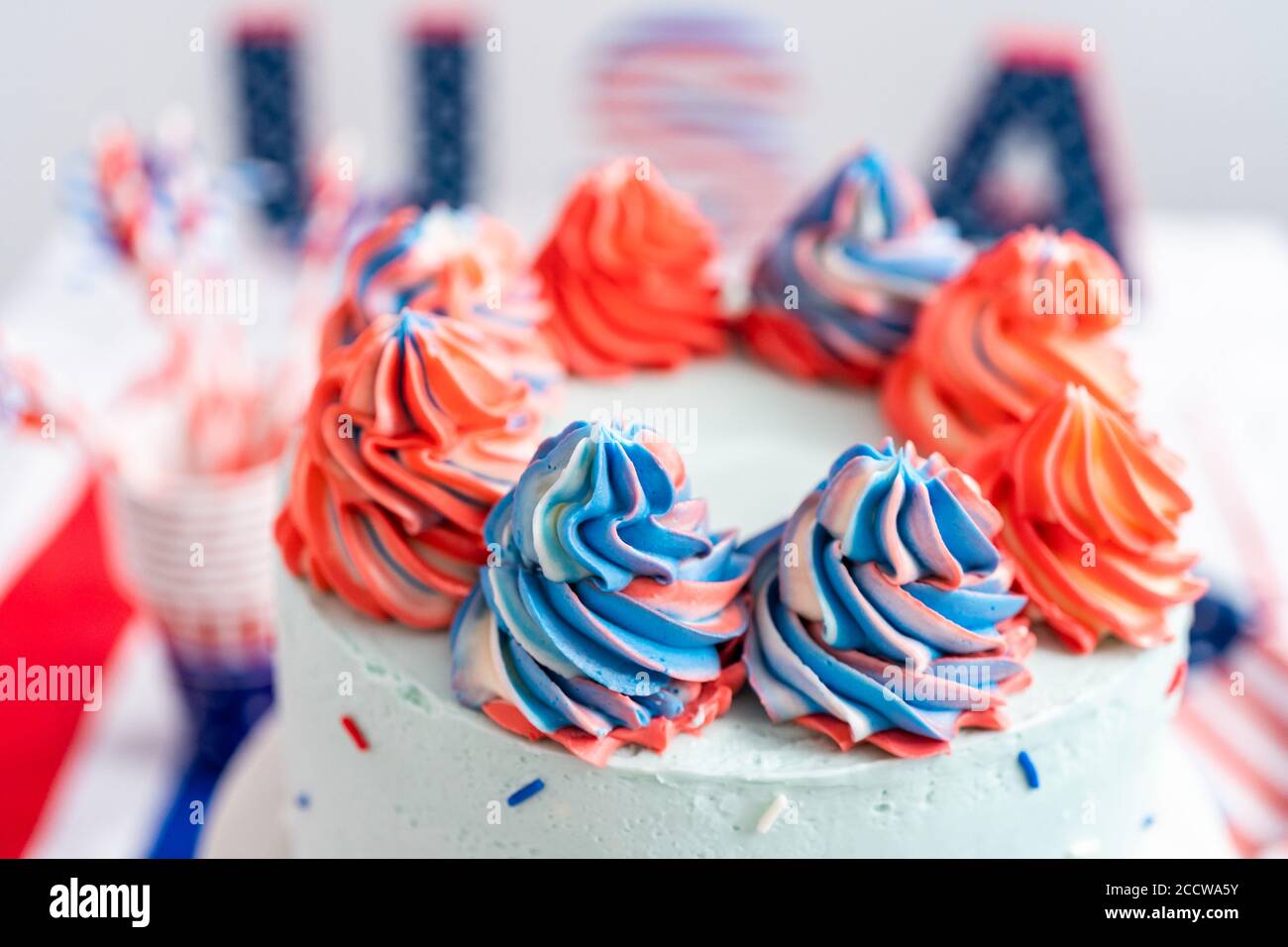 Red, white, and blue round vanilla cake with buttercream frosting for ...