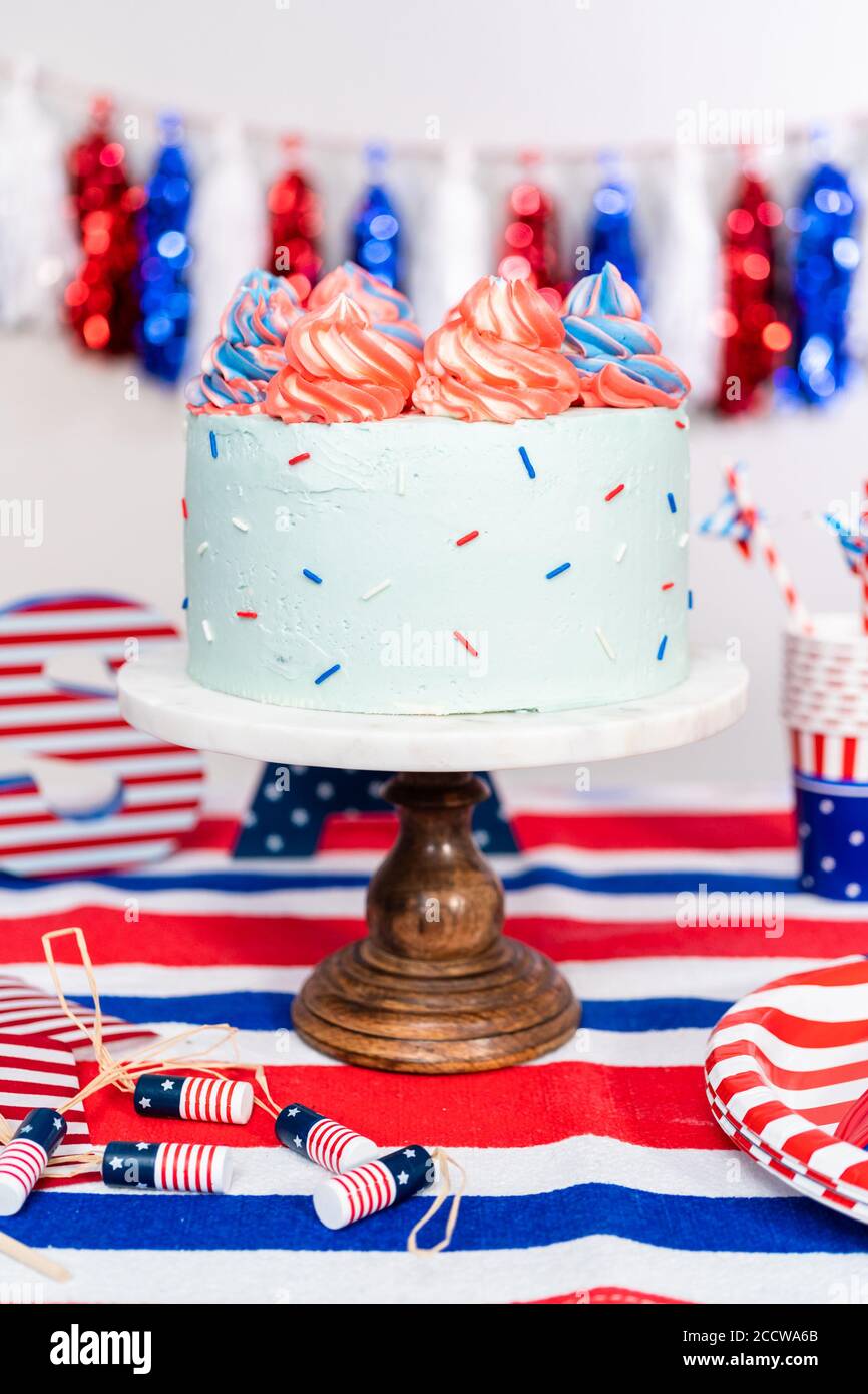 Red, white, and blue round vanilla cake with buttercream frosting for ...