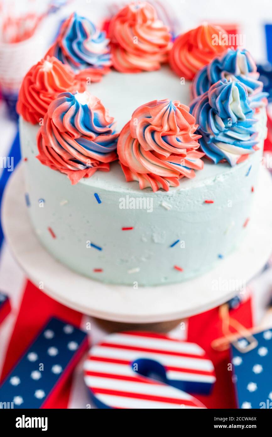 Red, white, and blue round vanilla cake with buttercream frosting for ...