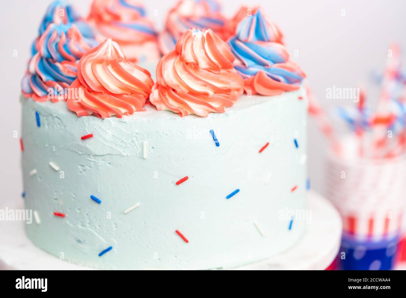 Red, white, and blue round vanilla cake with buttercream frosting for ...