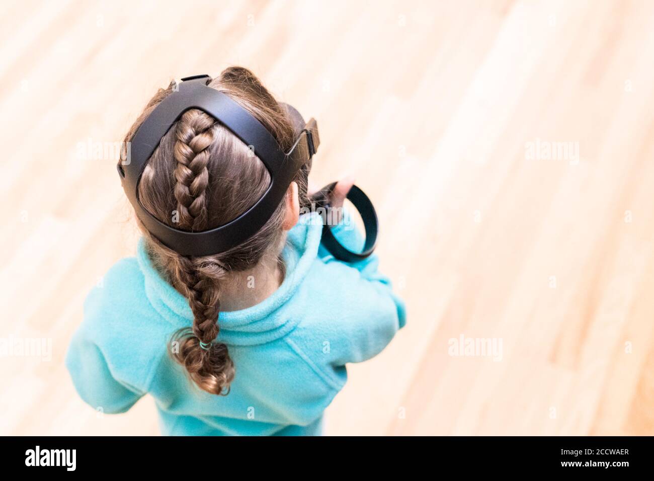 Little girl playing VR kids game in the living room Stock Photo - Alamy
