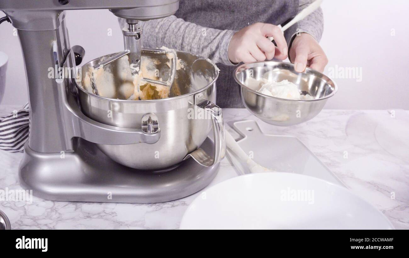 Step by step. Mixing ingredients in standing kitchen mixer to bake ...