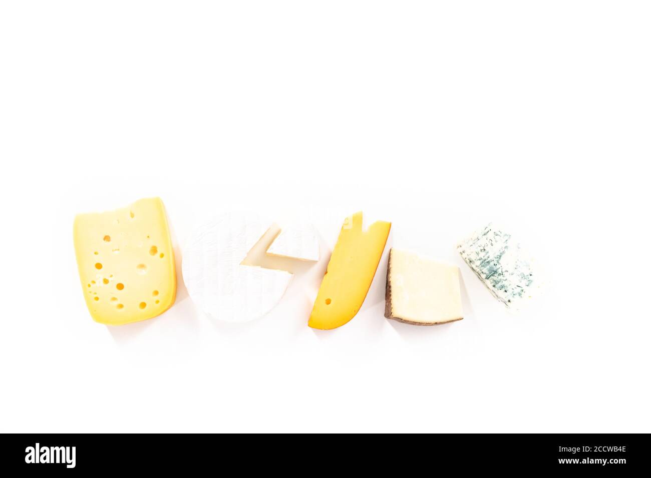 Variety of large wedges gourmet cheese on a white background Stock ...