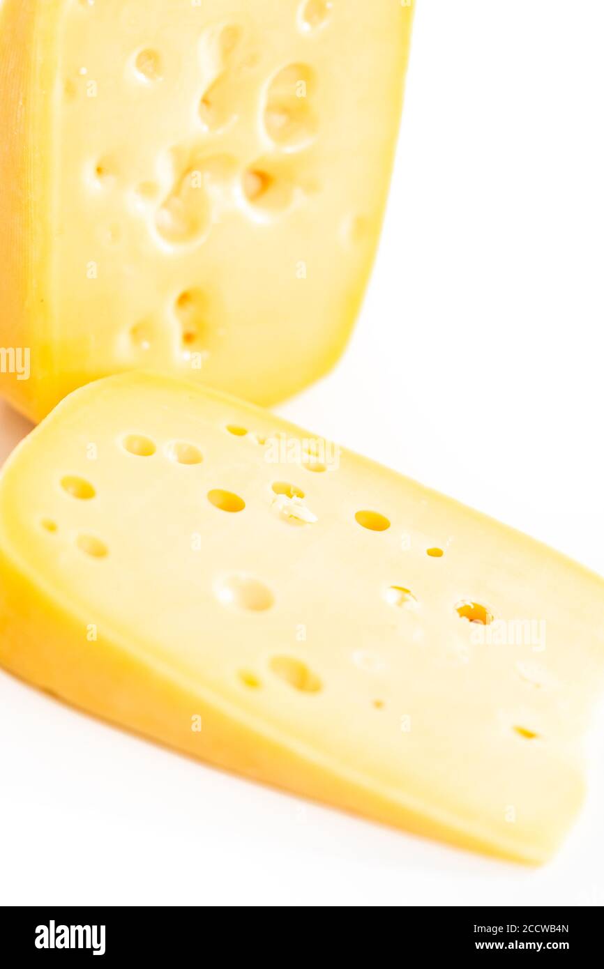Large slice of semi soft part skim cheese on a white background Stock ...