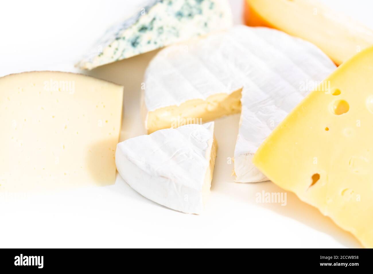 Variety of large wedges gourmet cheese on a white background Stock ...