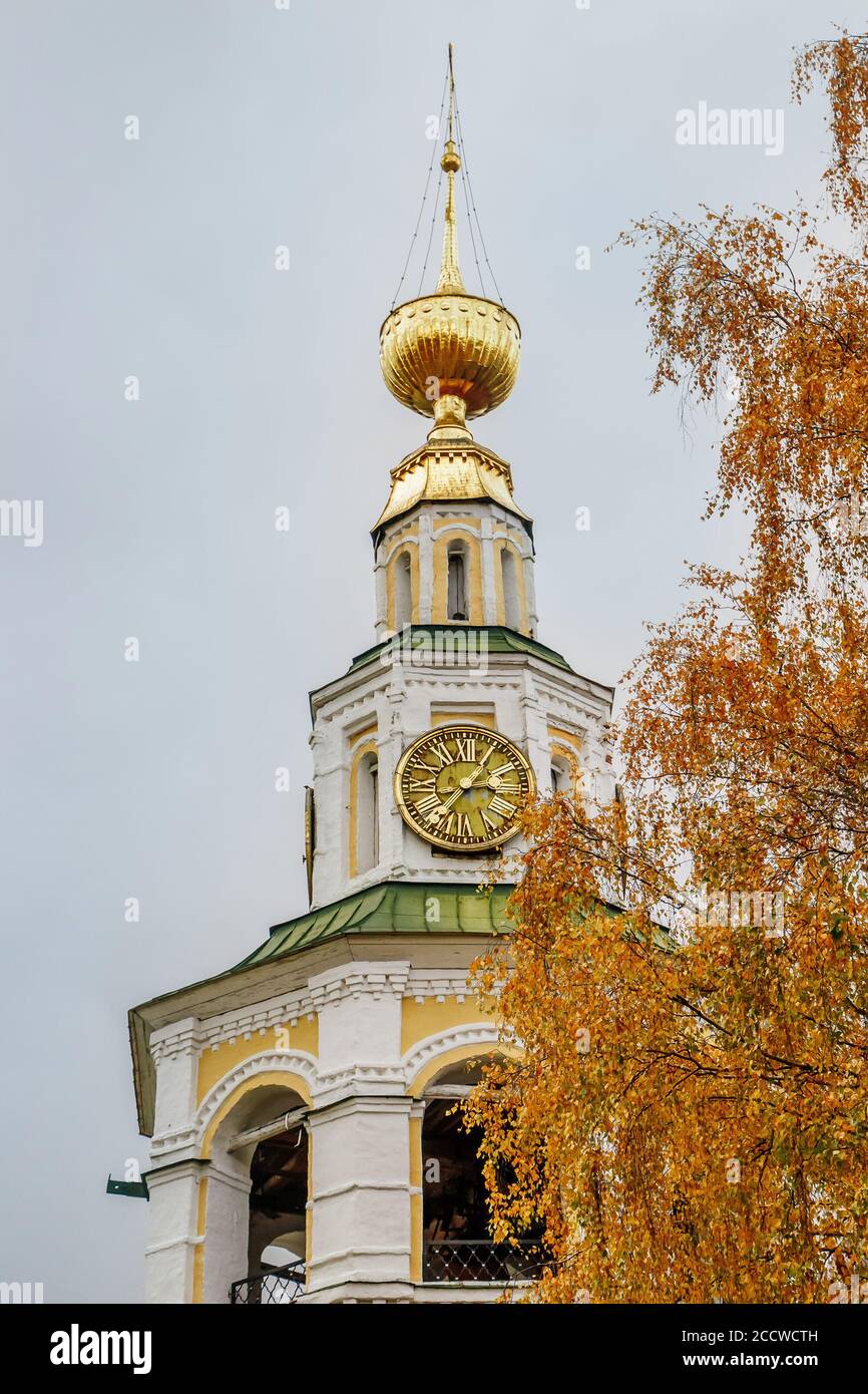 Ancient christian church and autumn yellow trees. Beautiful domes, high ...