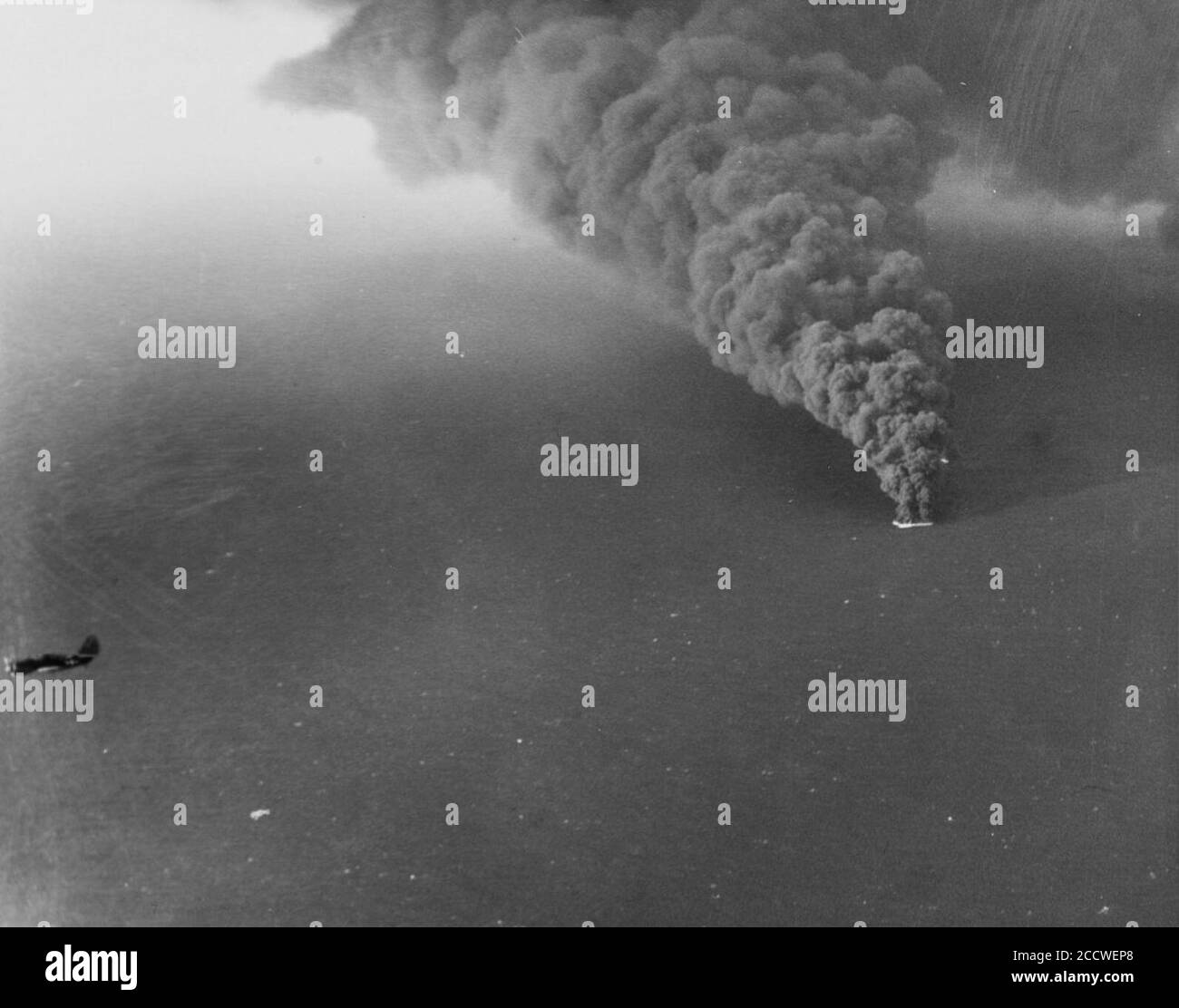 Japanese ship left burning by carrier based planes of Task Force 38 on ...