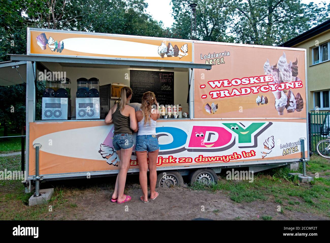 Two Polish teenage girls waiting for their ice cream (lody) treats ...