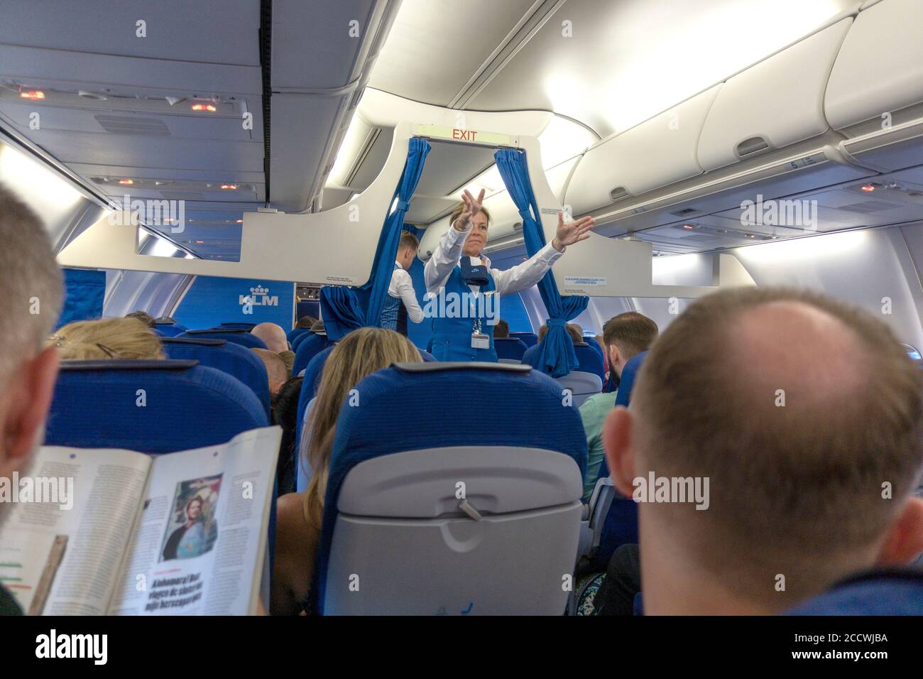 KLM airplane, stewardess demonstrating airplane safety features. Warsaw ...
