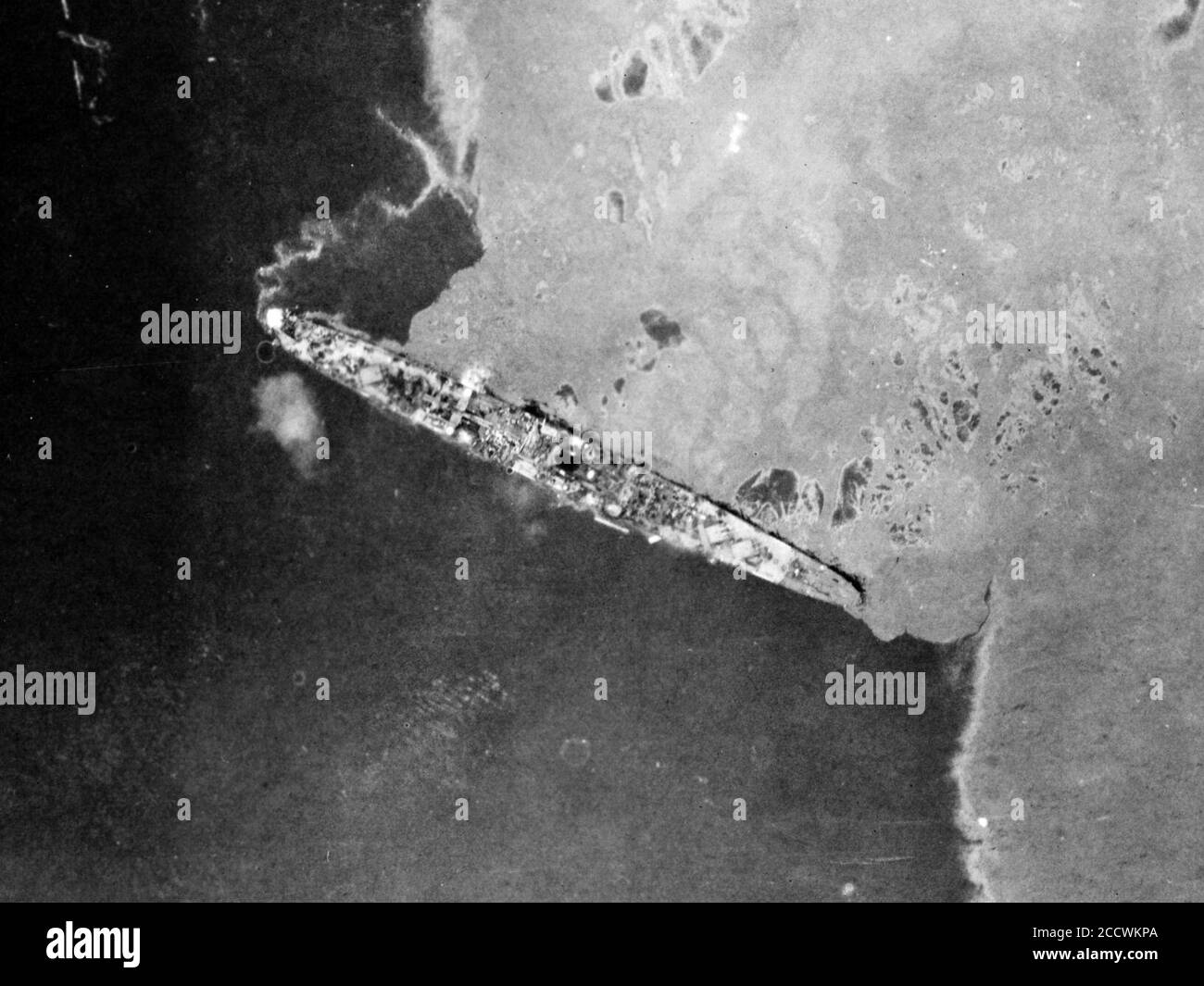 Japanese light cruiser Yahagi lies motionless after a torpedo hit, 7 ...