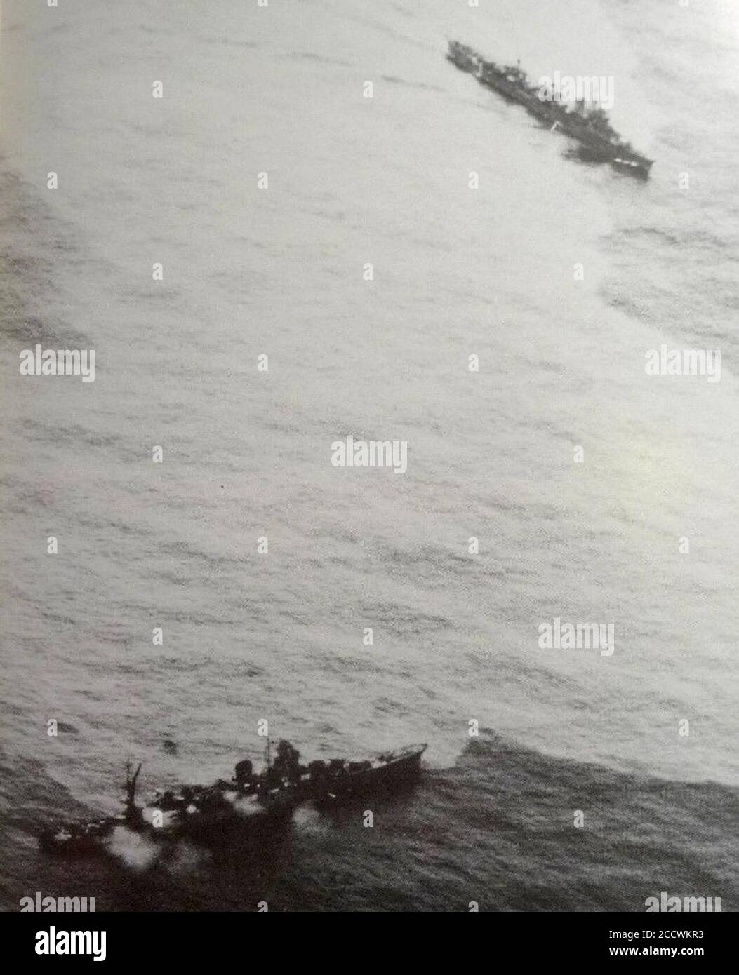 Japanese light cruiser Yahagi and destroyer Isokaze under attack on 7 ...