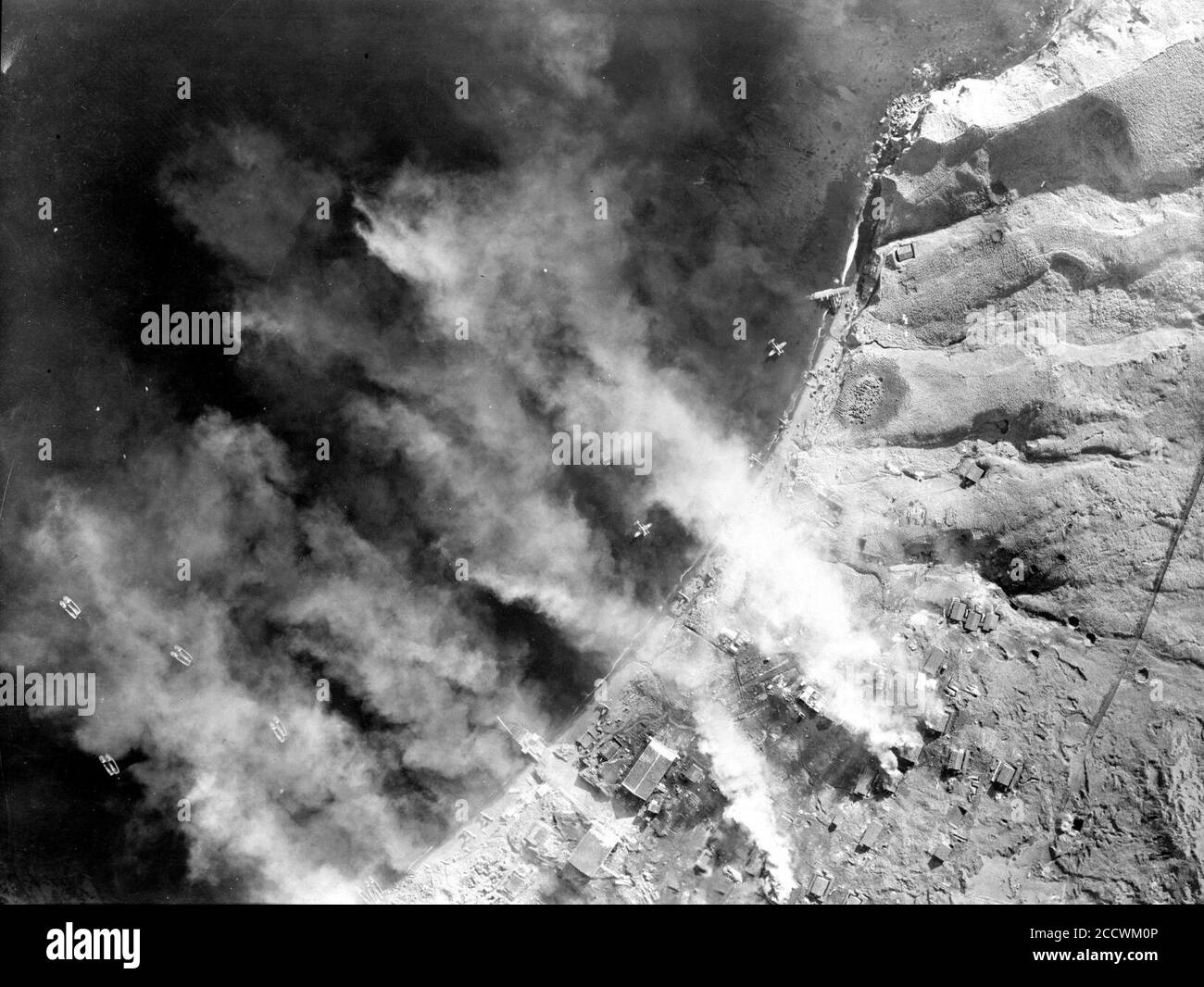 Japanese seaplane base being bombed c1943 Stock Photo - Alamy