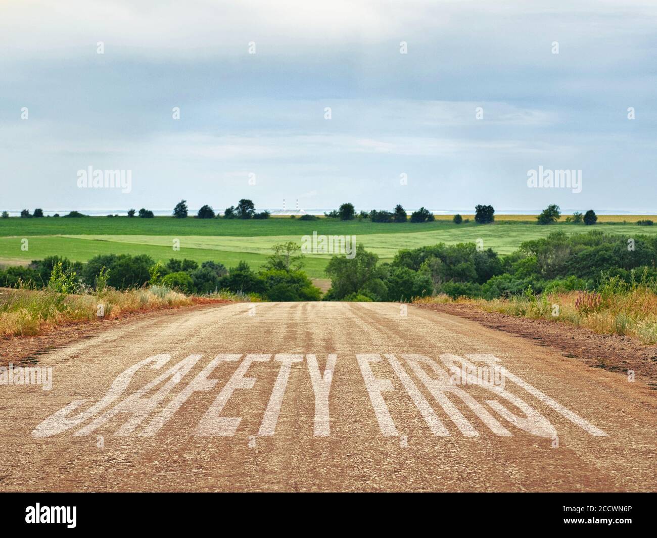 Safety first. Text on asphalted road in countryside Stock Photo - Alamy