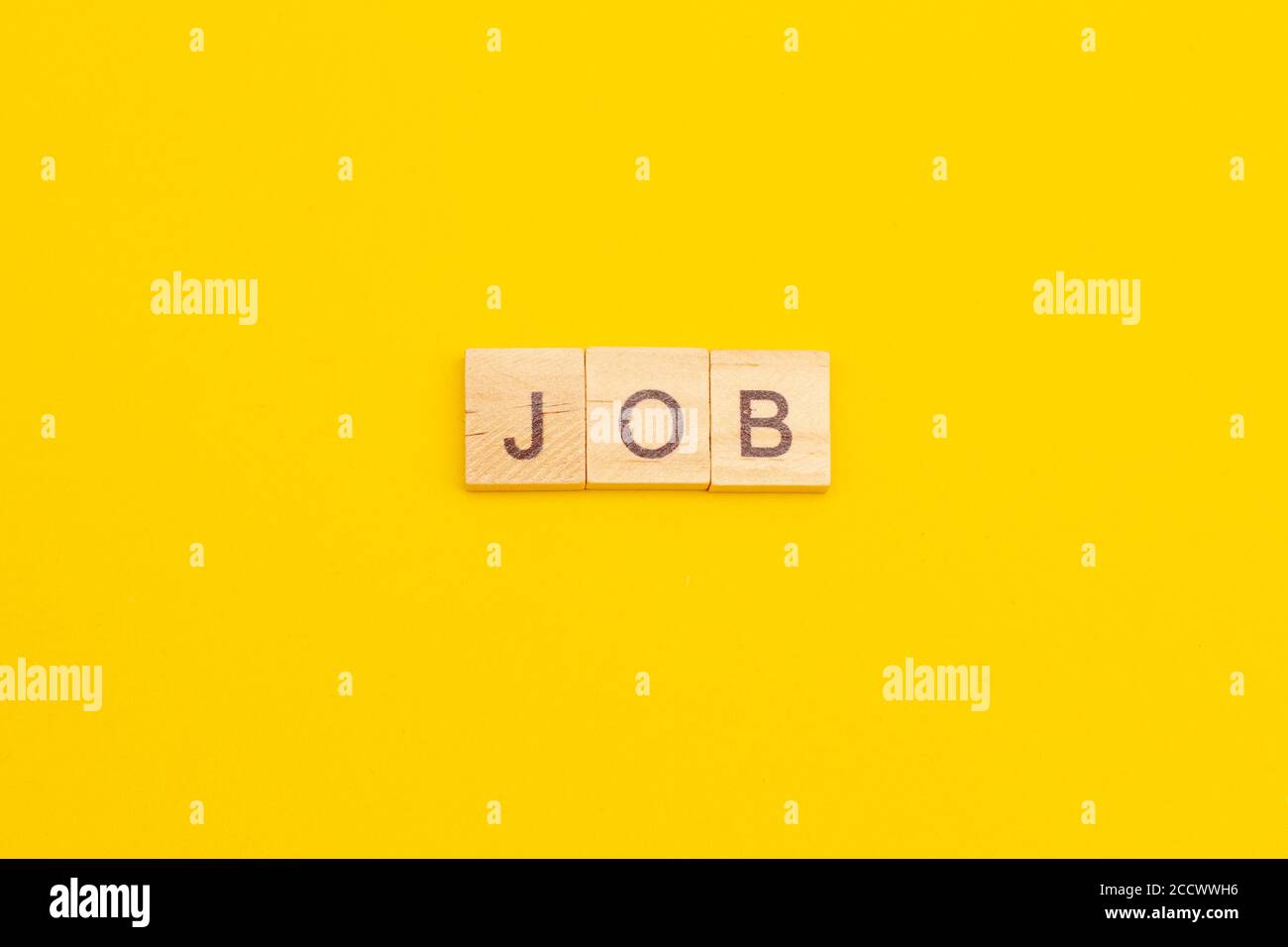 Word JOB made from wooden cubes on yellow background. Business concept ...