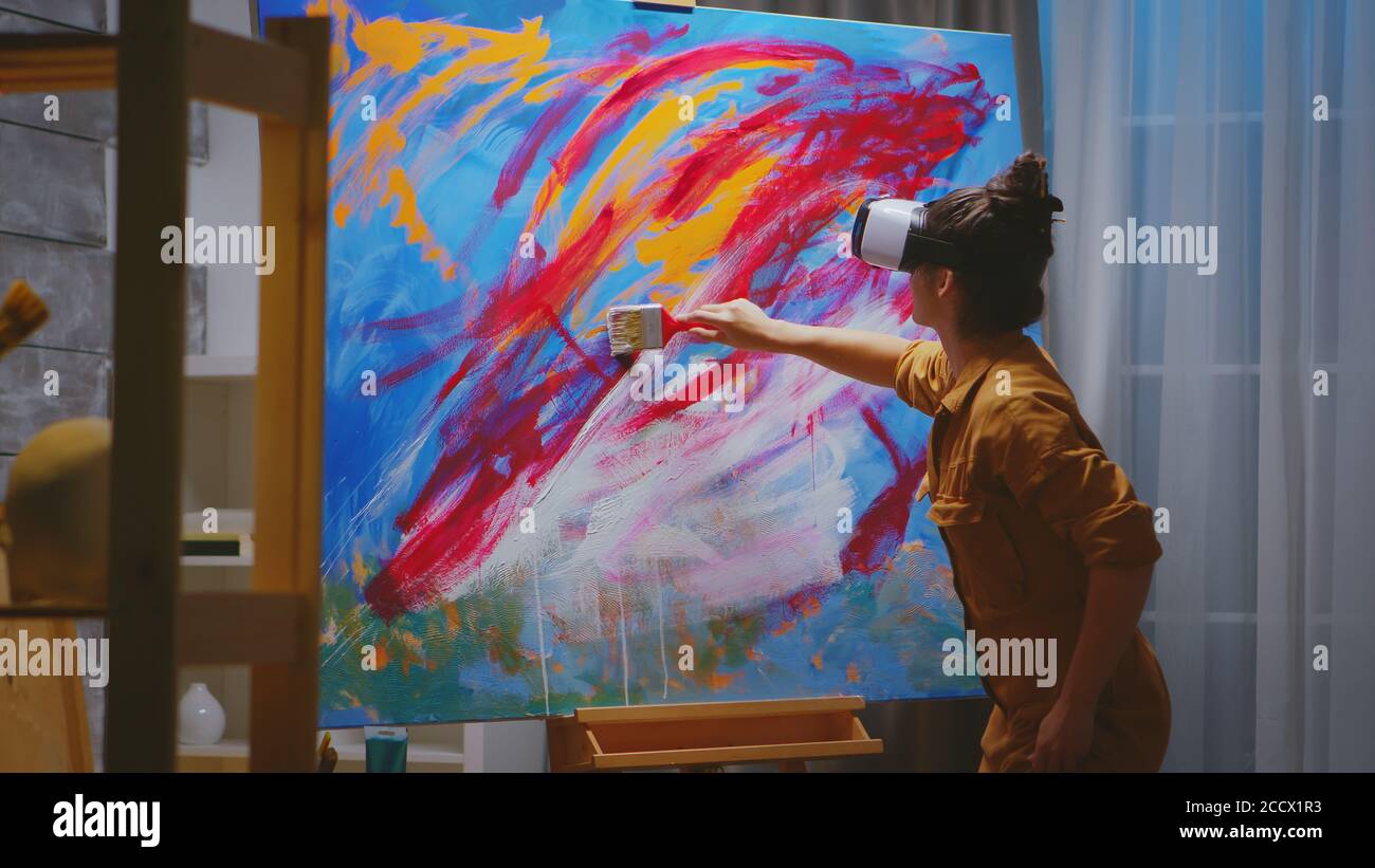Creative artist painting using vr headset in studio Stock Photo - Alamy