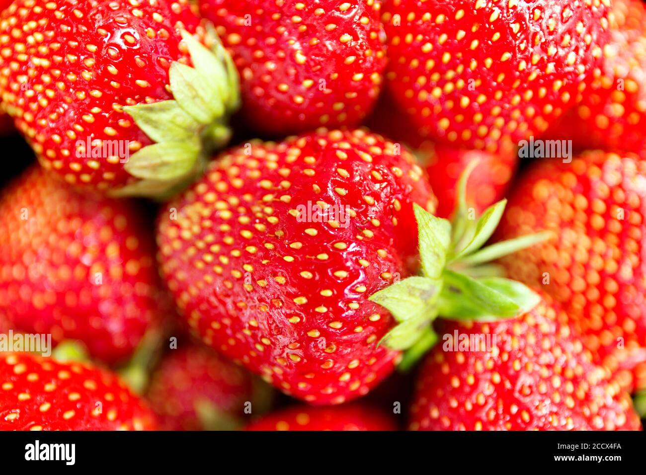Fresh red srawberry close up background. Macro photo Stock Photo - Alamy