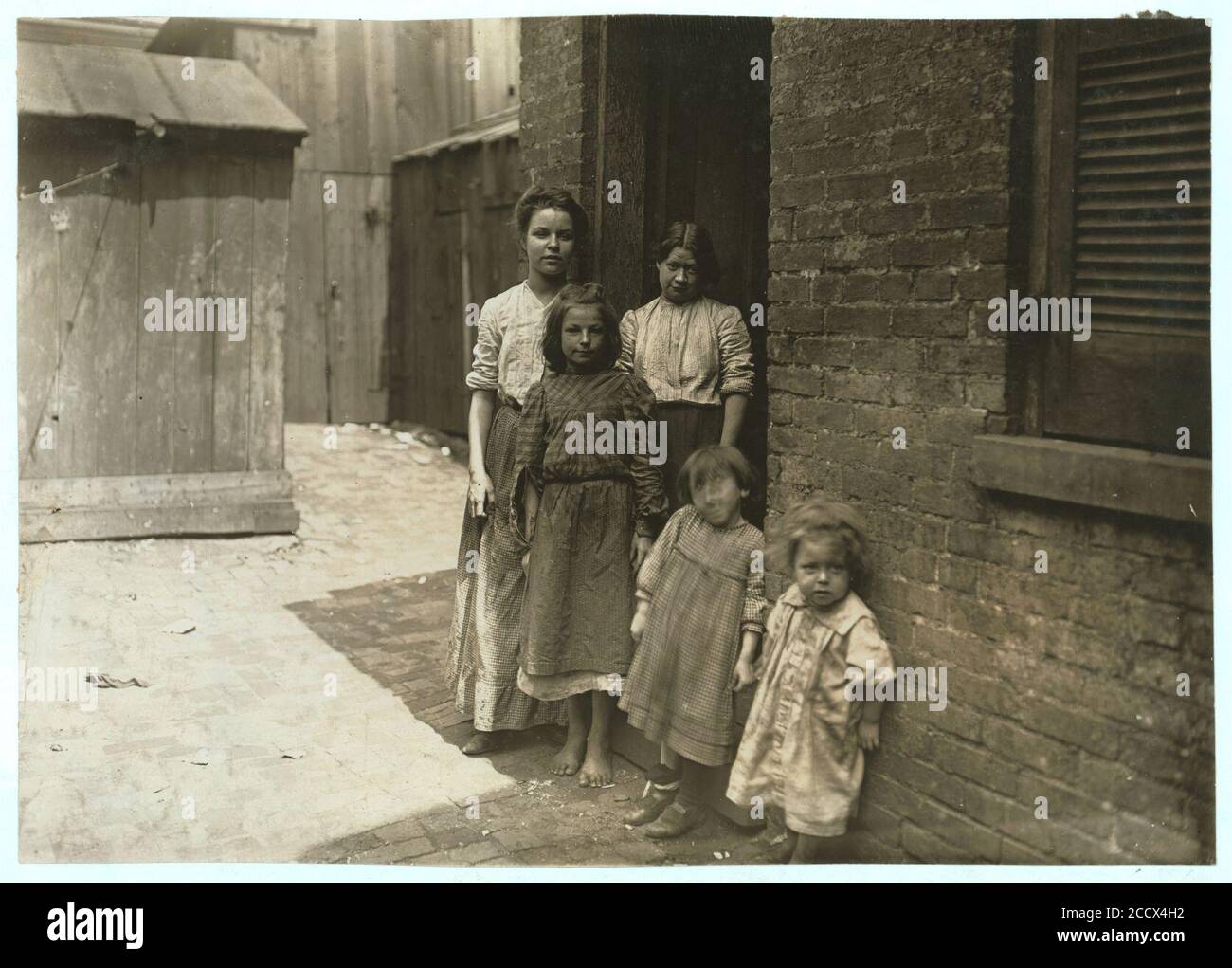 Jessie D-- (the tallest girl) and some of her charges. Girl in doorway ...