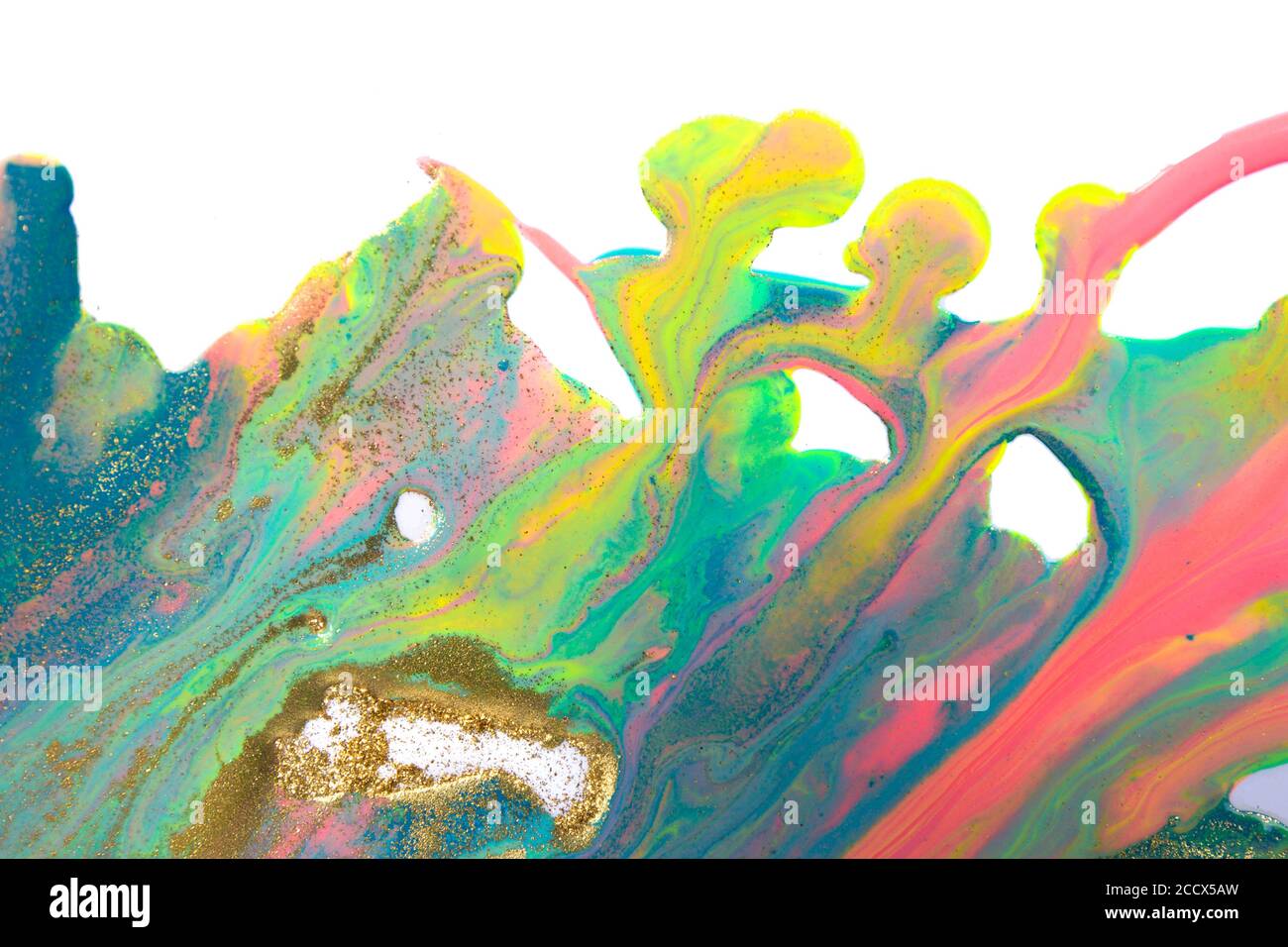 Colorful mixed inks splattered on white paper background. Copyspace ...