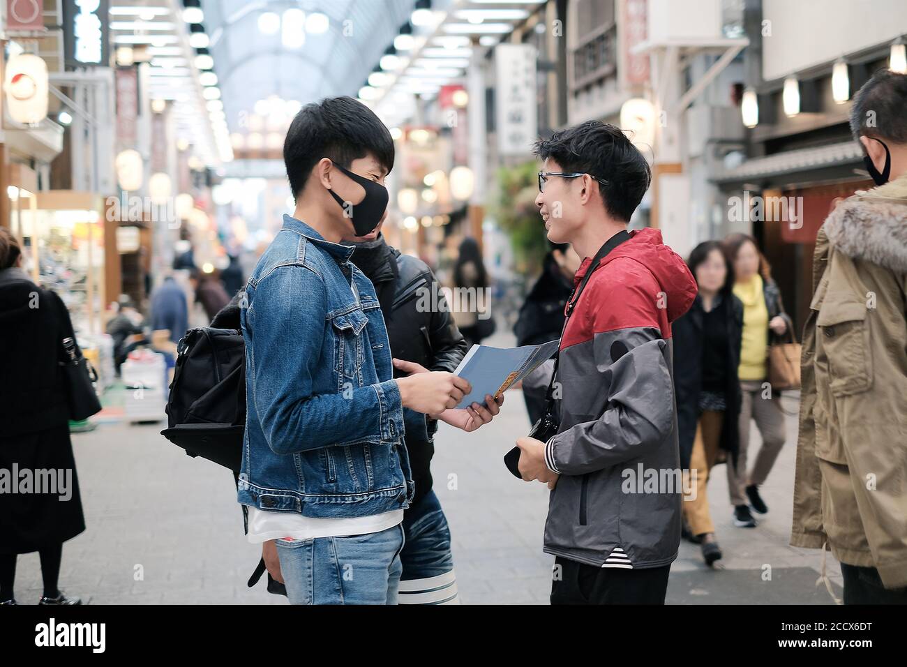 Group of young asian friends stop talking about the trip for travel on ...