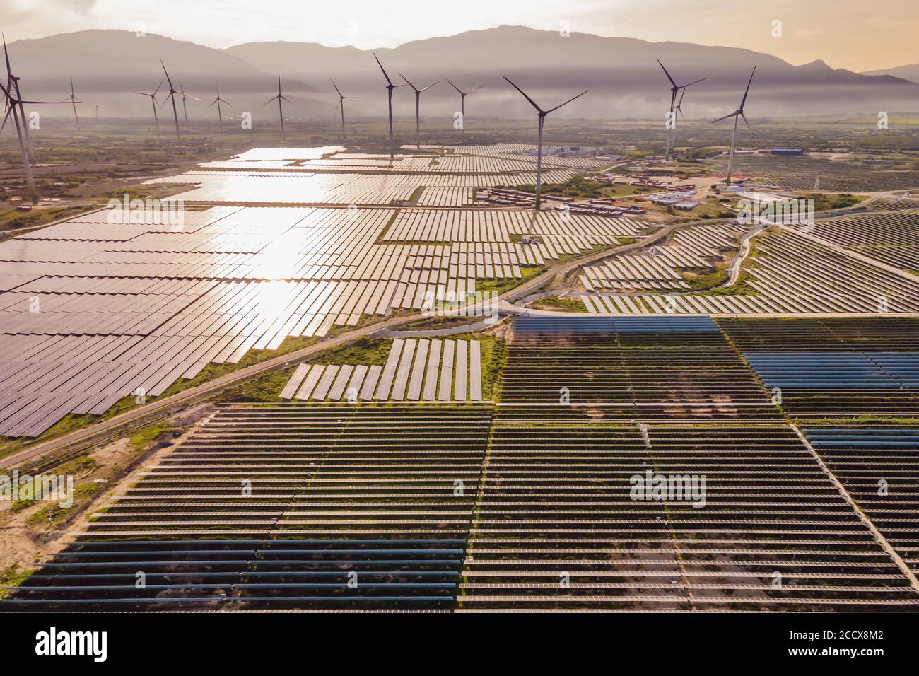 solar energy panels and wind turbine. Drone view Stock Photo - Alamy
